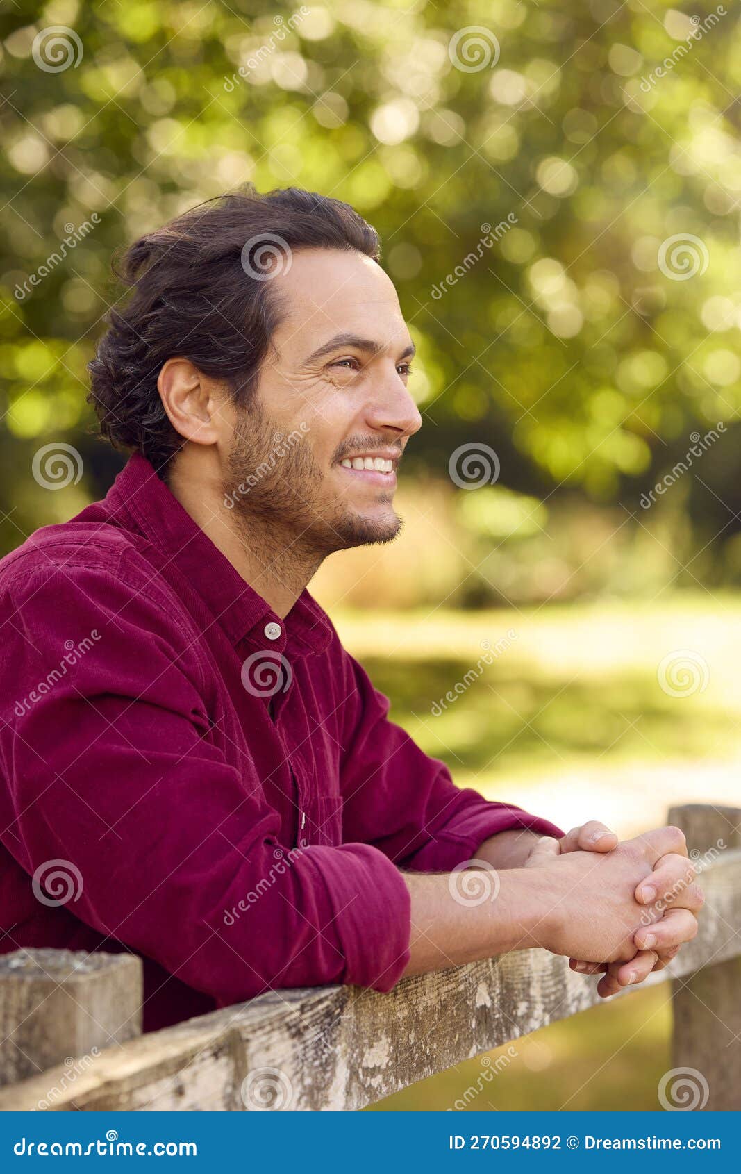 Portrait of Smiling Casually Dressed Mature Man Leaning on Fence on ... Portrait of Smiling Casually Dressed Mature Man Leaning on Fence on ...