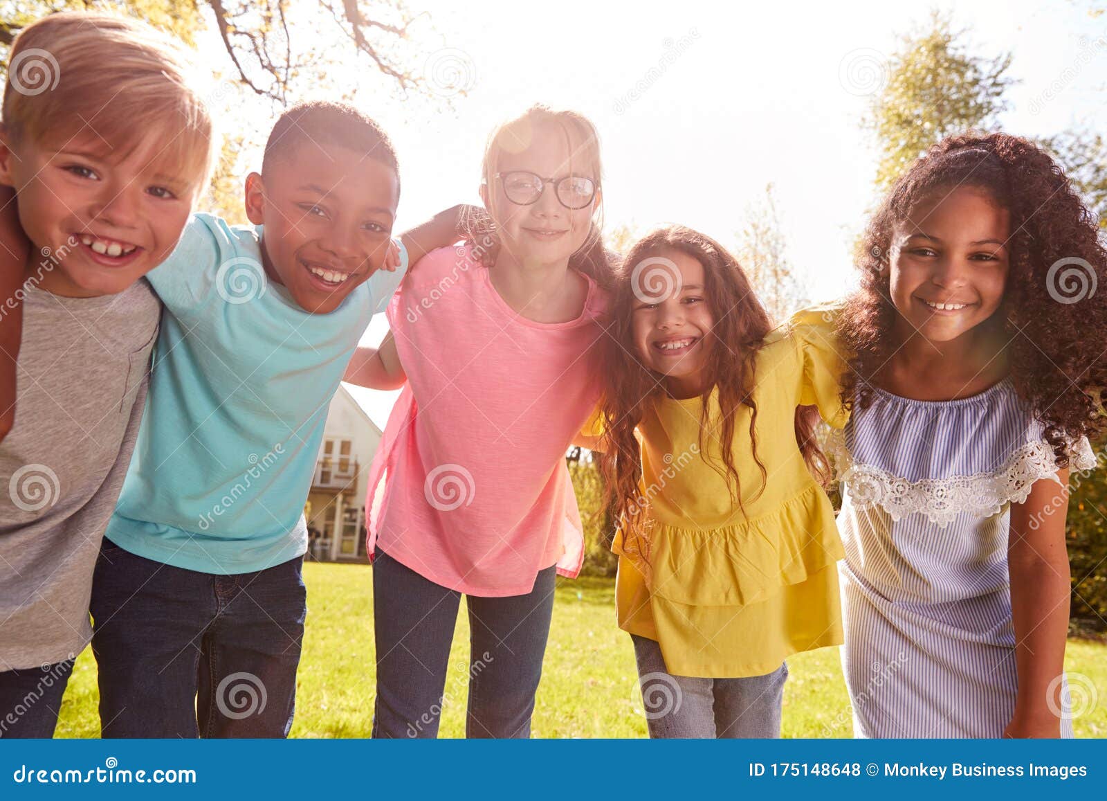 Portrait of Smiling Children Outdoors at Home Looking into Camera Stock ...