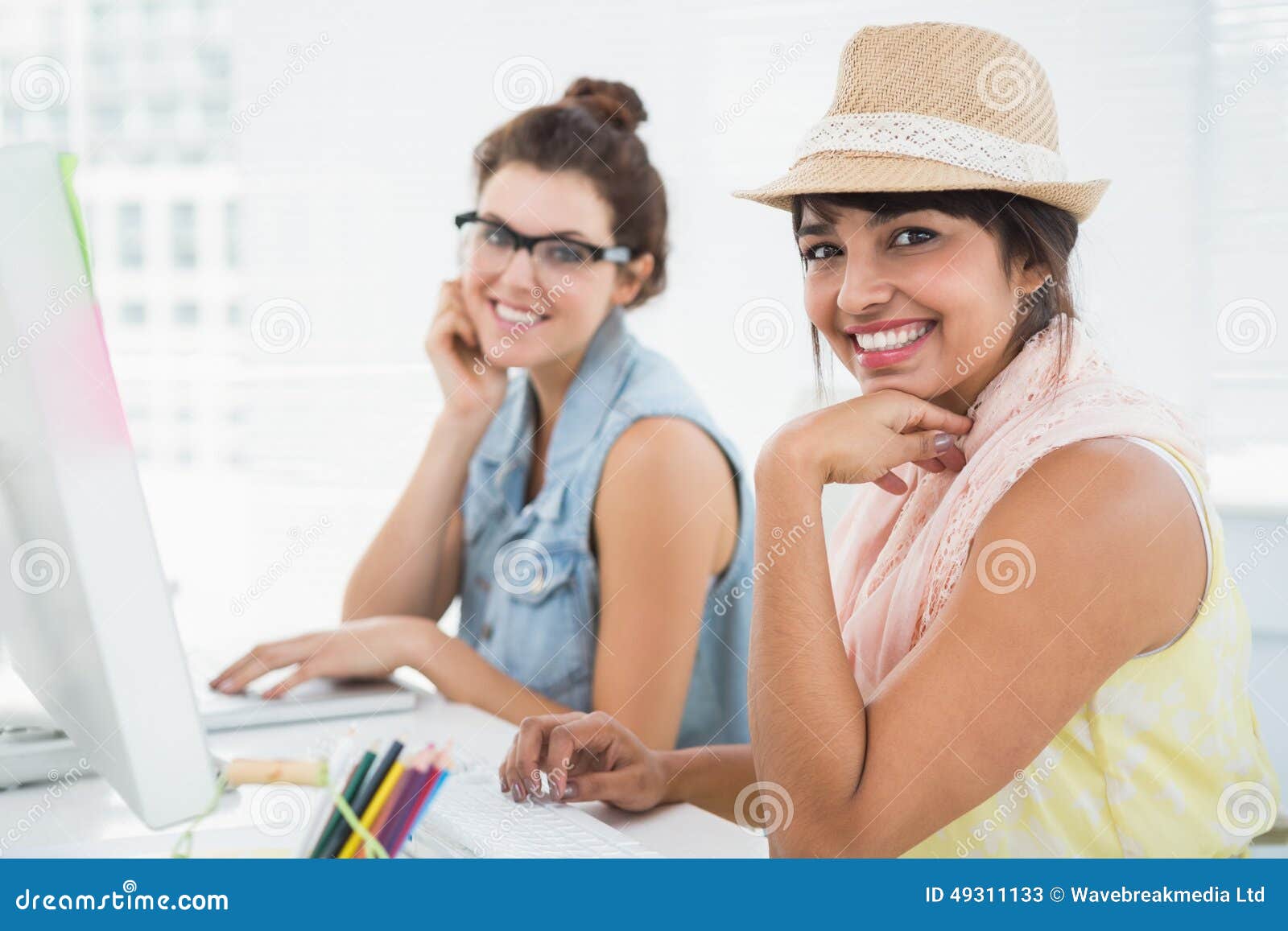 Portrait of Smiling Colleagues Sitting and Posing Stock Image - Image ...