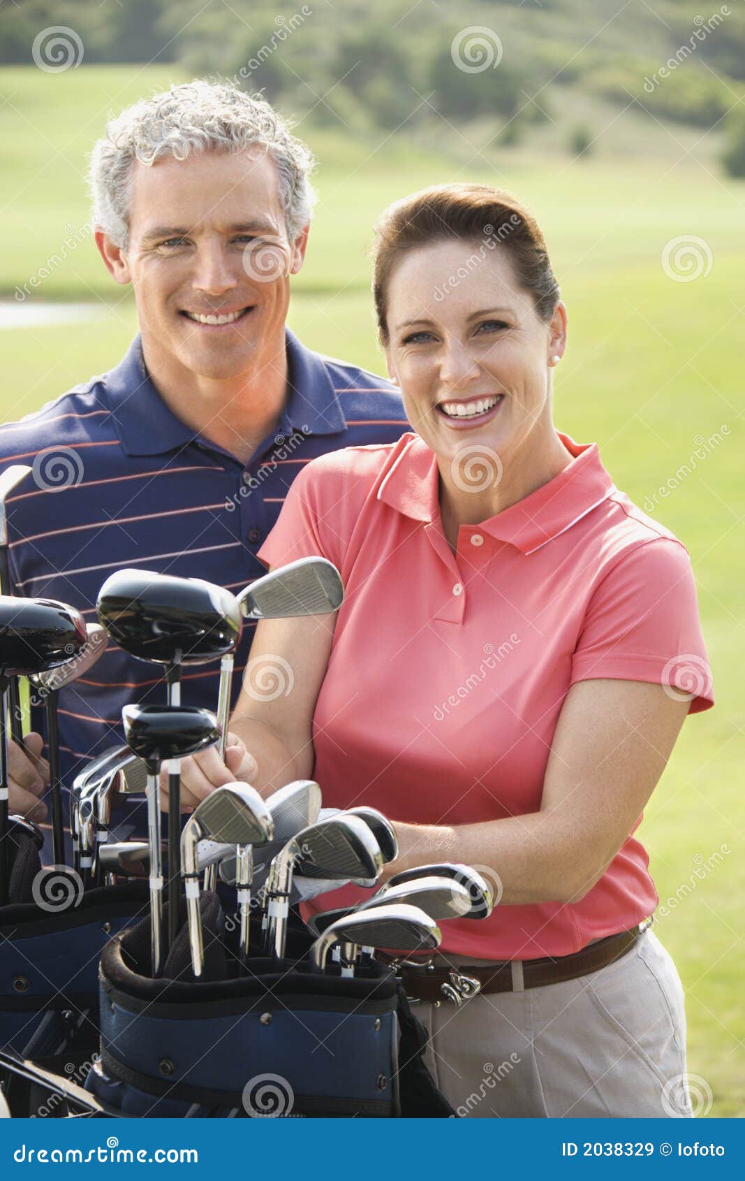 Portrait of Smiling Couple Playing Golf Stock Image - Image of colour ...