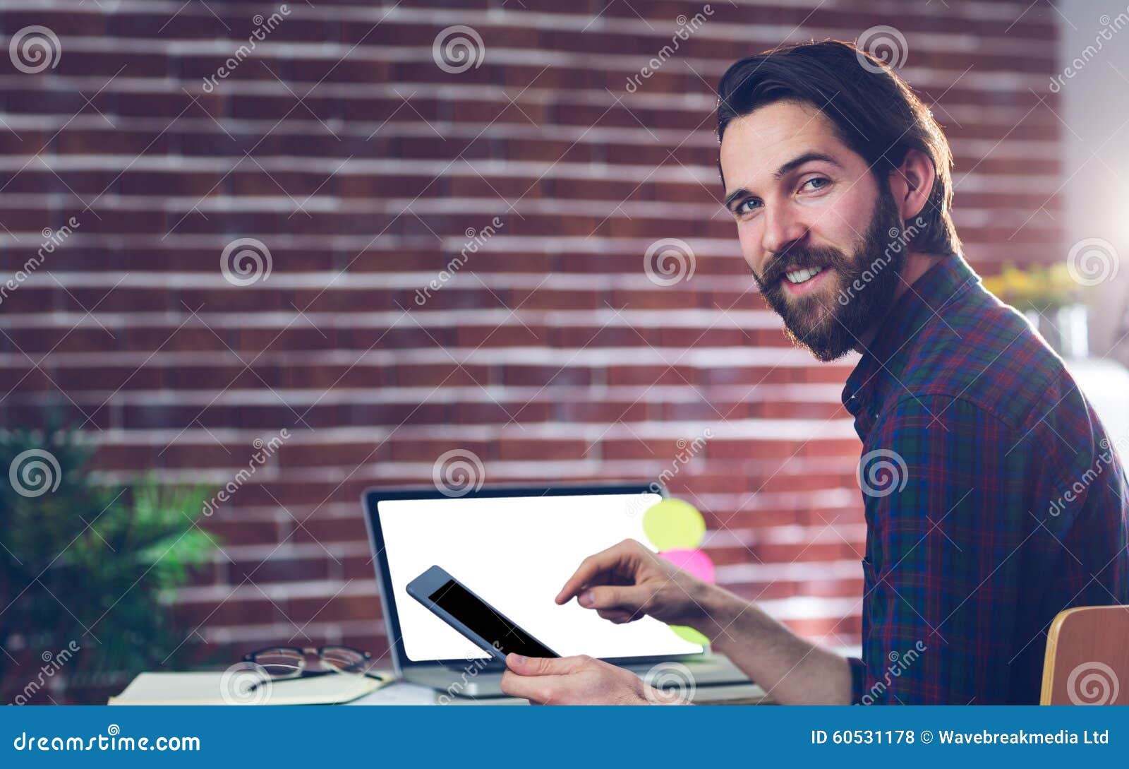 Portrait Of Smiling Creative Businessman Using Digital Tablet Stock