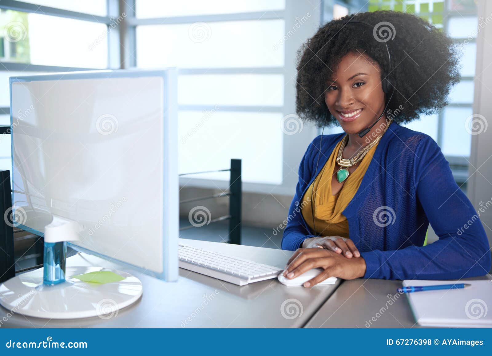 Portrait of a Smiling Customer Service Representative with an Afro at ...