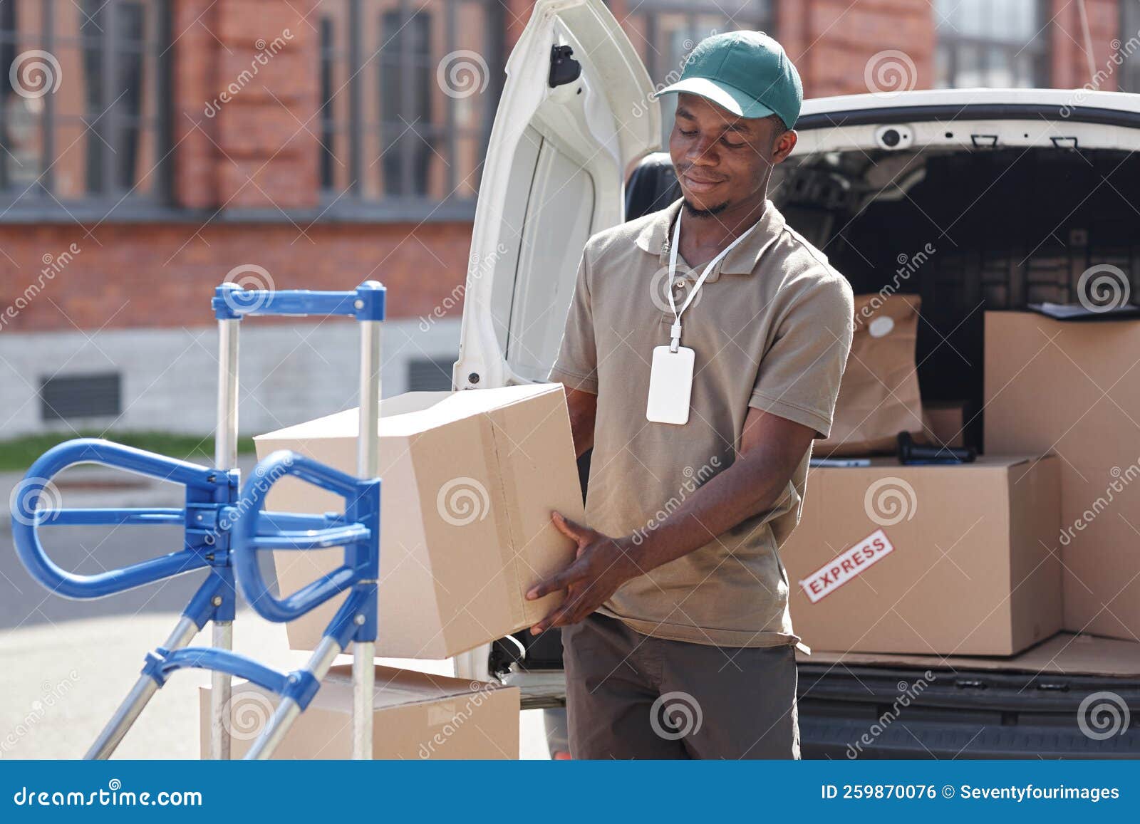 Male Delivery Worker Unloading Boxes Stock Photo - Image of work ...