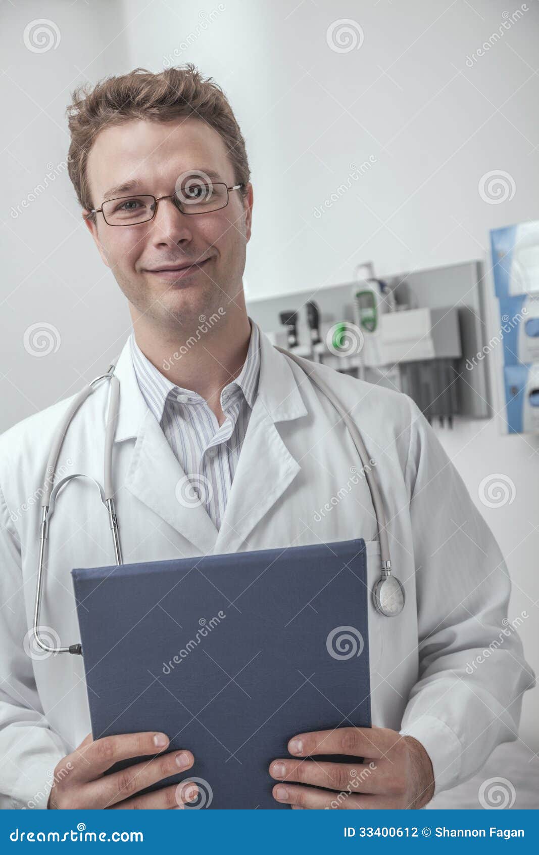 Portrait of Smiling Doctor Holding a Clipboard Stock Photo - Image of ...