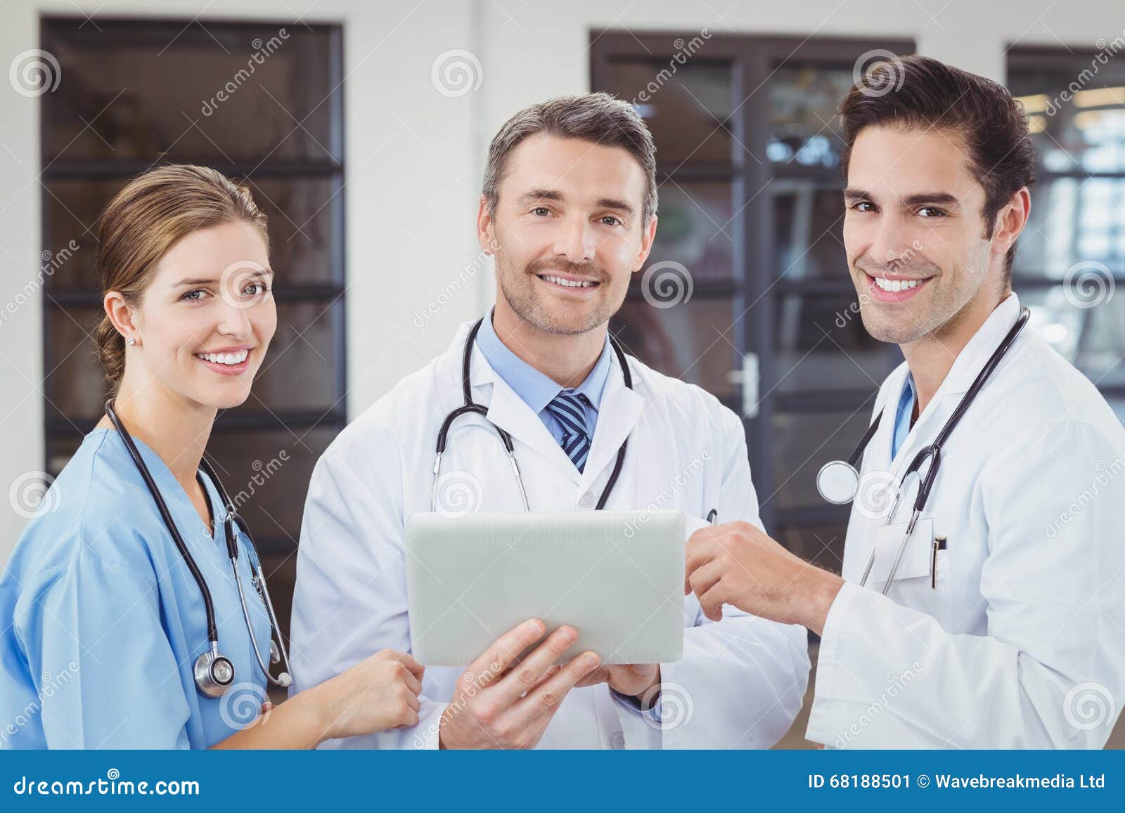 Portrait of Smiling Doctors Holding Digital Tablet Stock Image - Image ...