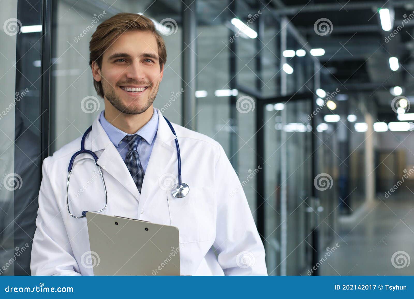 Portrait of Smiling Excited Doctor in Hospital Stock Image - Image of ...