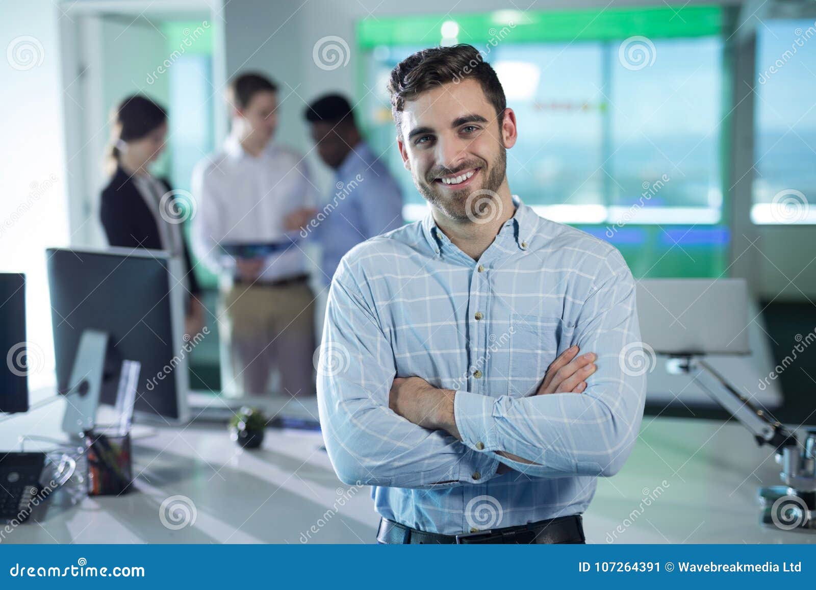 Portrait of Smiling Executives Standing with Arms Crossed Stock Image ...