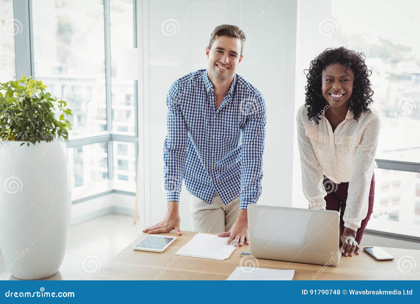 Portrait of Smiling Executives Standing at Desk Stock Photo - Image of ...