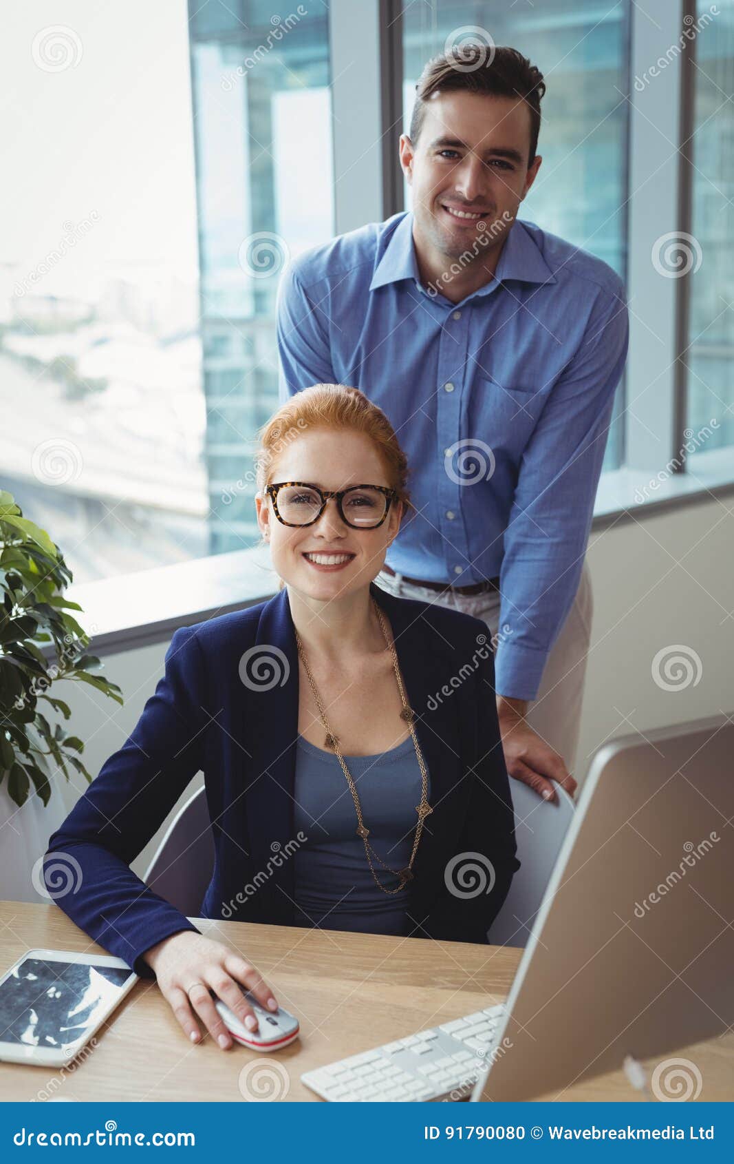 Portrait of Smiling Executives Working at Desk Stock Photo - Image of ...