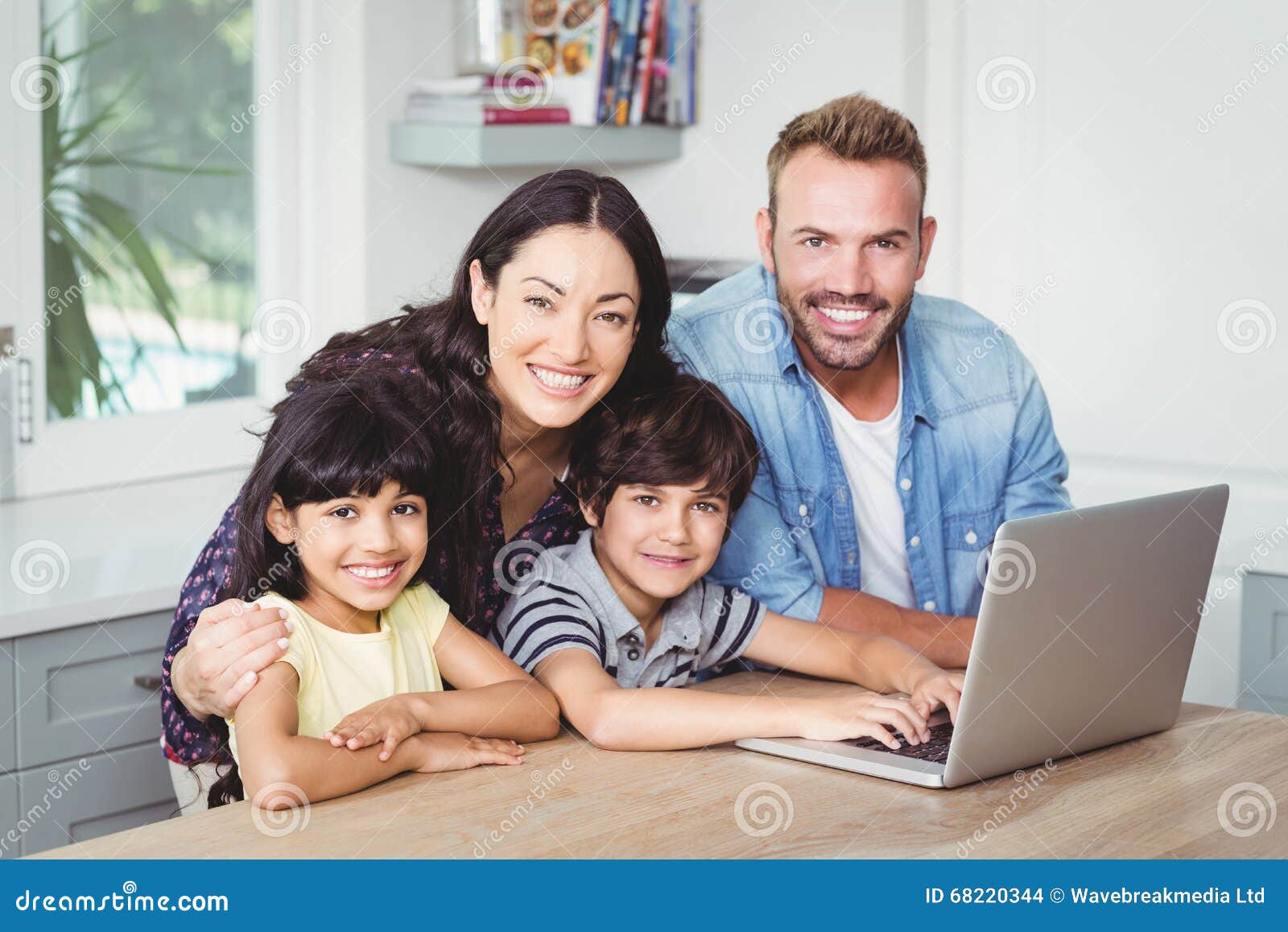 Portrait of Smiling Family Using Laptop Stock Photo - Image of indoors ...