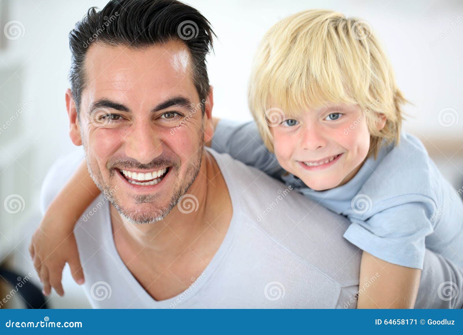 Portrait of Smiling Father and His Boy on His Back Stock Image - Image ...