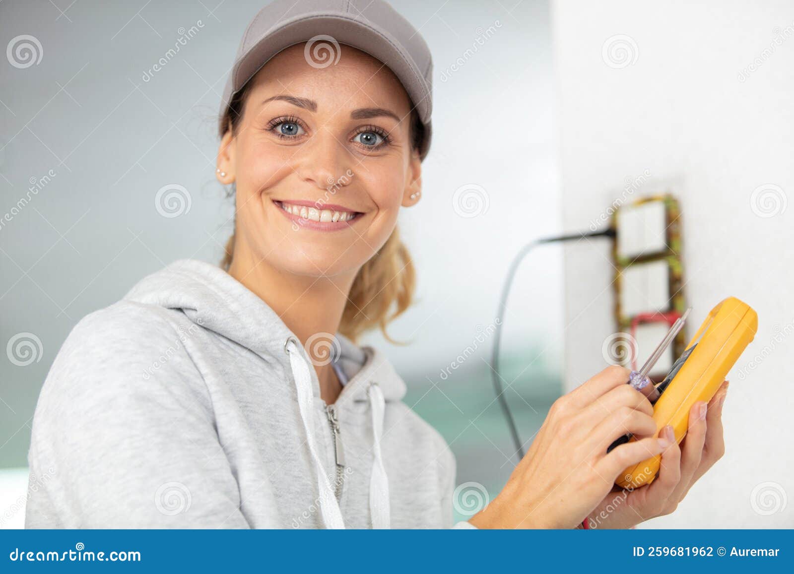 Portrait Smiling Female Electrician Using Multimeter Stock Photo ...