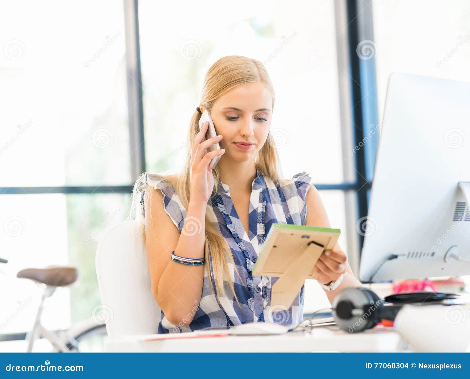 Portrait of Smiling Female Office Worker with Mobile Stock Photo ...