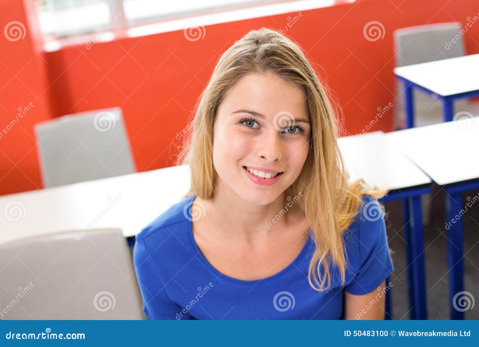 Portrait of Smiling Female Student in Classroom Stock Photo - Image of ...
