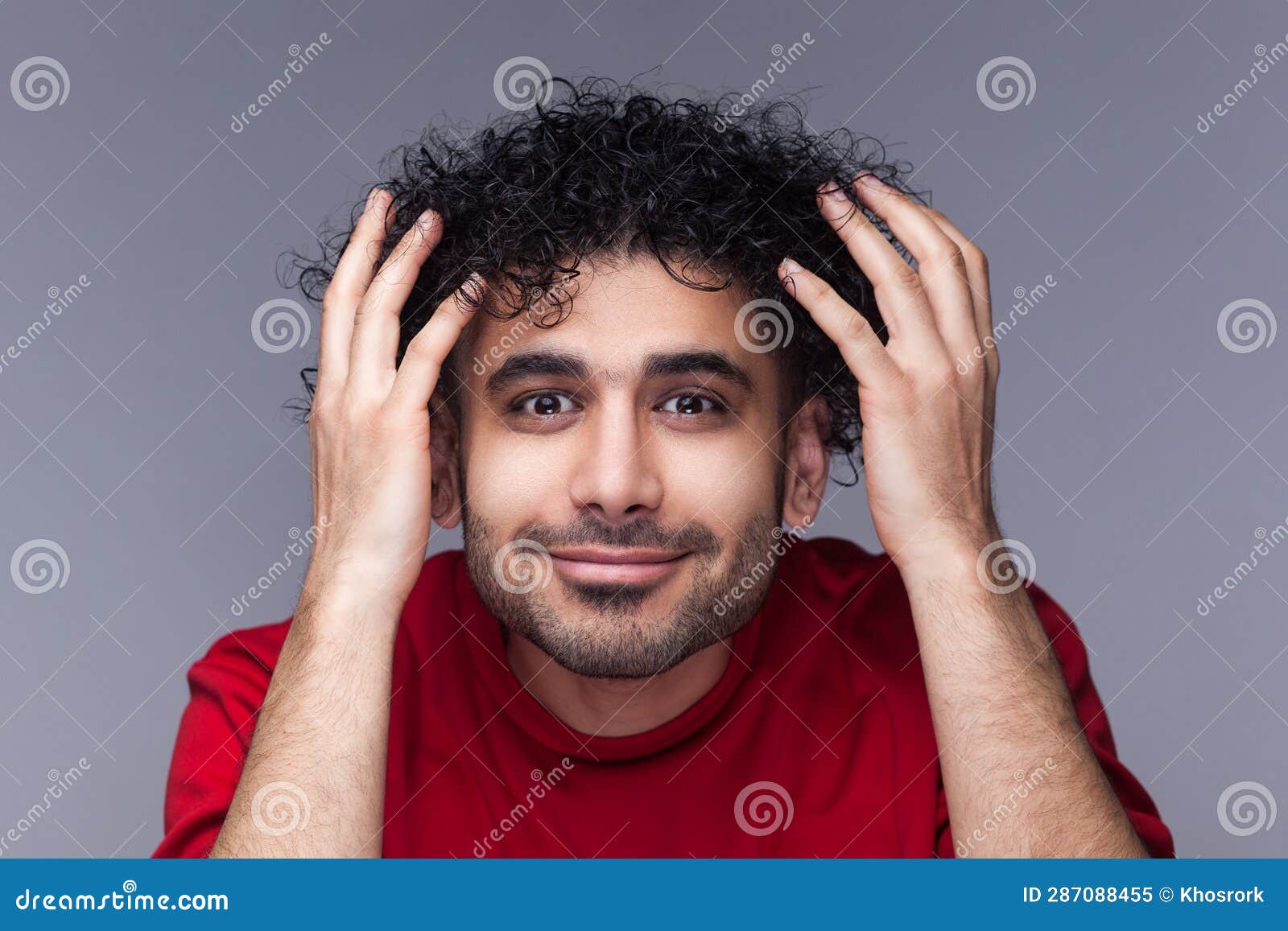 Smiling Funny Attractive Bearded Man With Dark Curly Hair Looking In