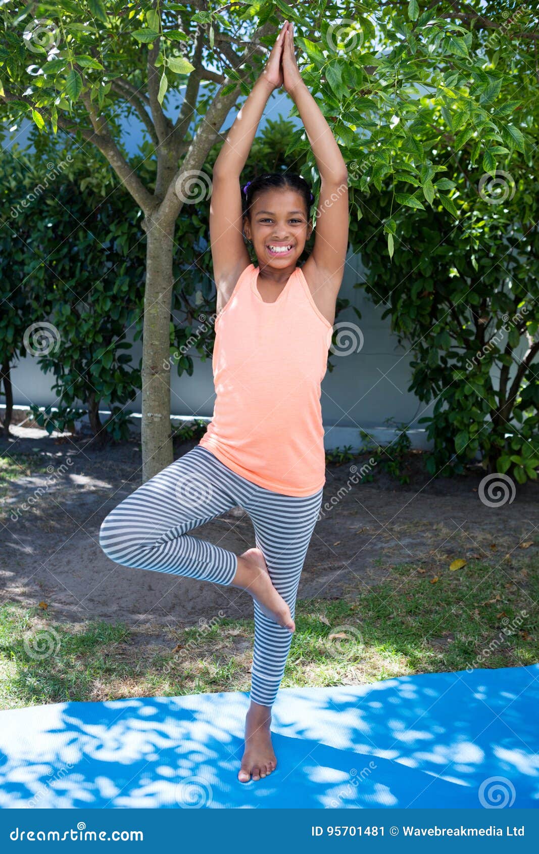 Portrait of Smiling Girl Doing Tree Pose Yoga Stock Image - Image of ...