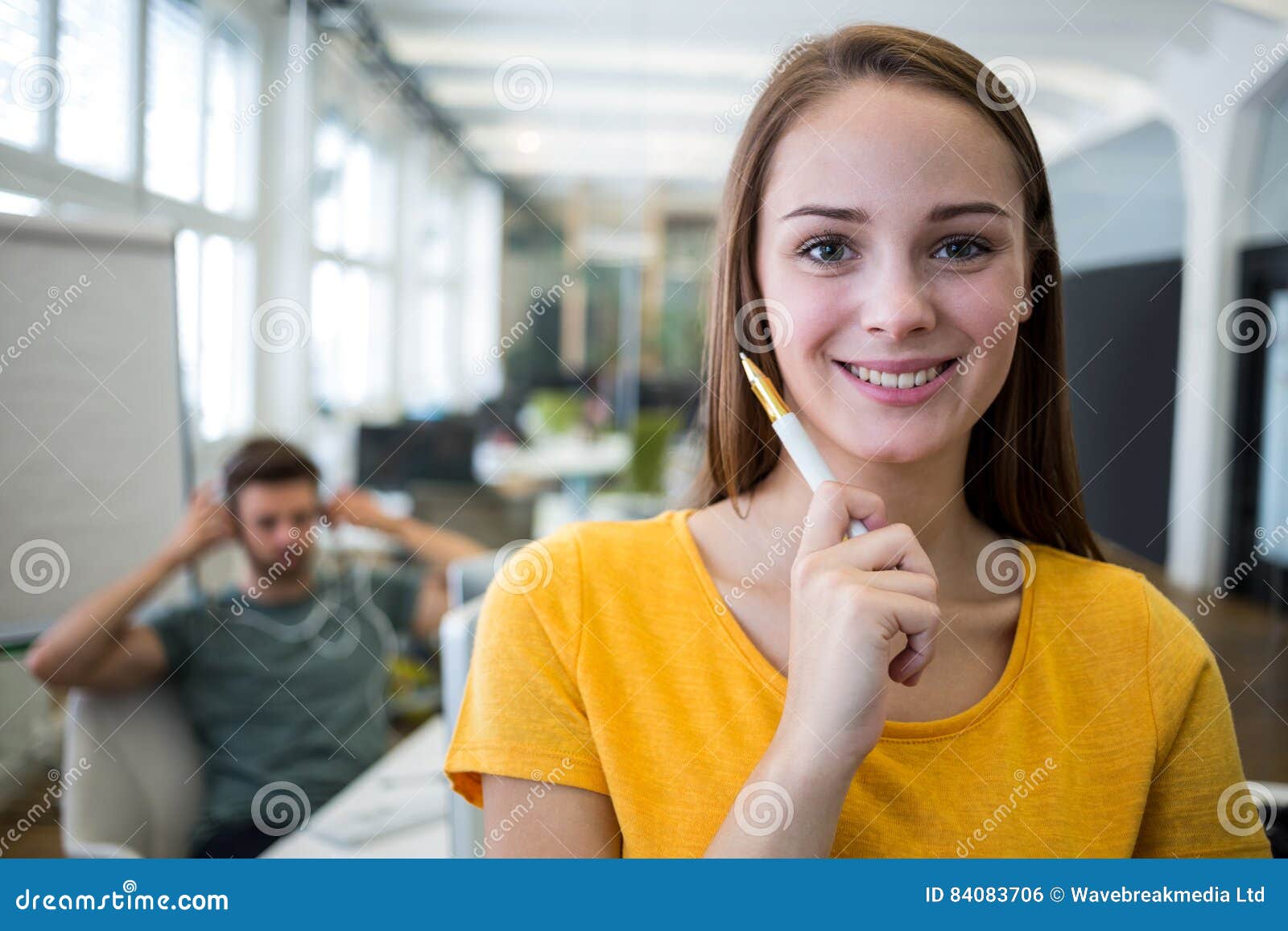 Portrait of Smiling Graphic Designer Standing with Pen Stock Photo ...