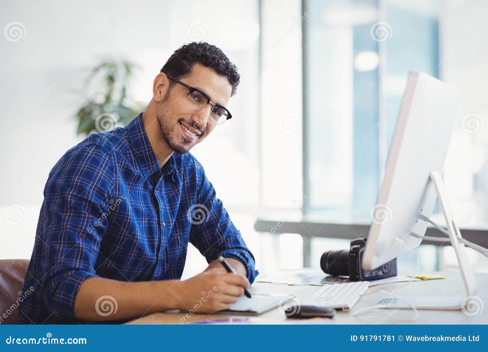 Portrait of Smiling Graphic Designer Using Graphic Tablet at Desk Stock ...