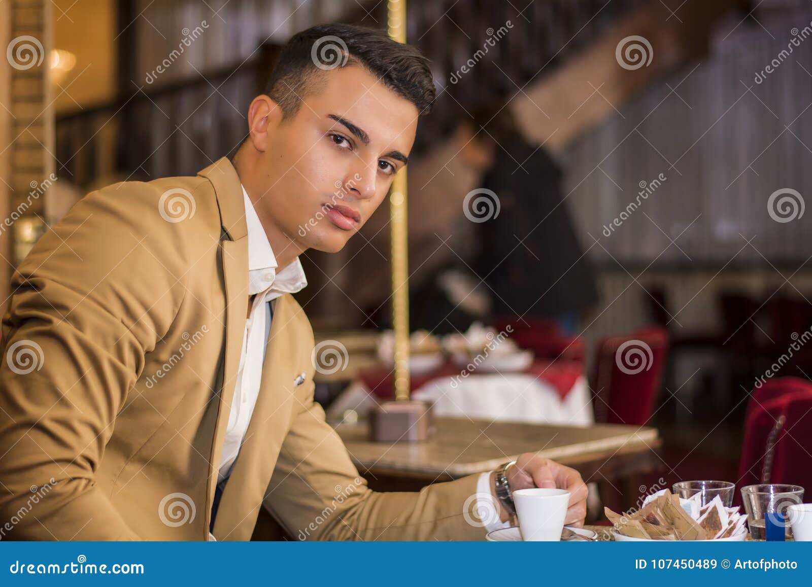 Handsome man in cafe stock image. Image of goodlooking - 107450489