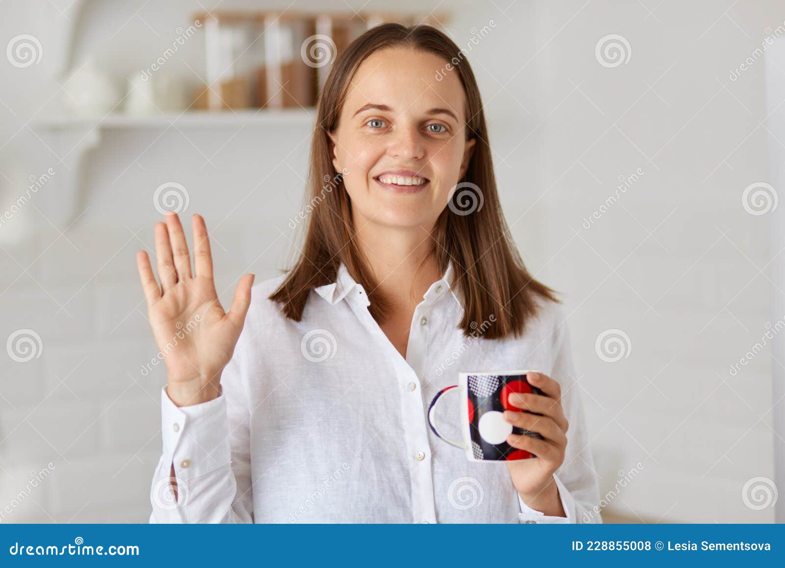 Portrait Of Smiling Happy Young Adult Woman Wearing White Shirt Looking