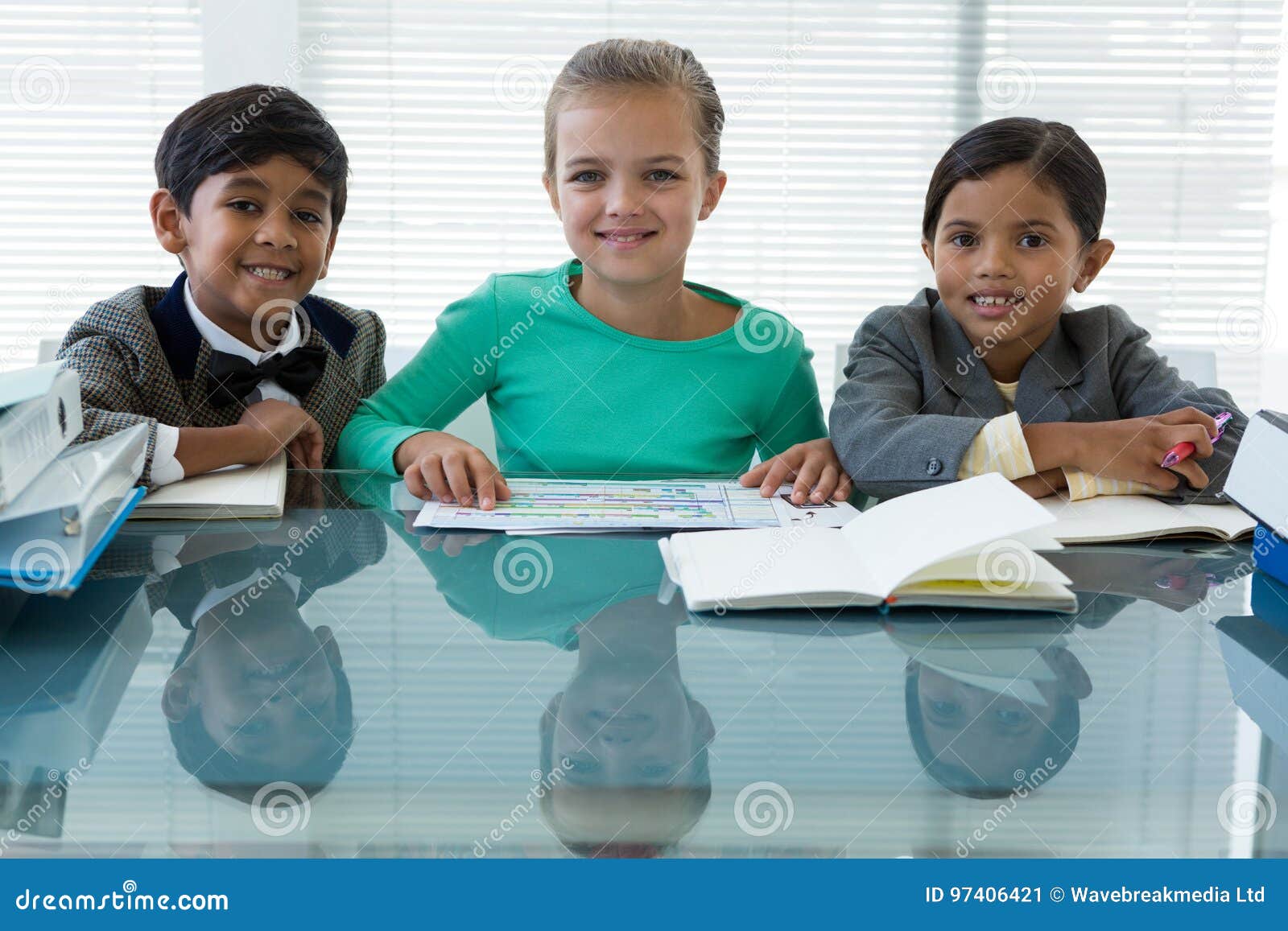 Portrait of Smiling Kids Discussing in Boardroom Stock Image - Image of ...