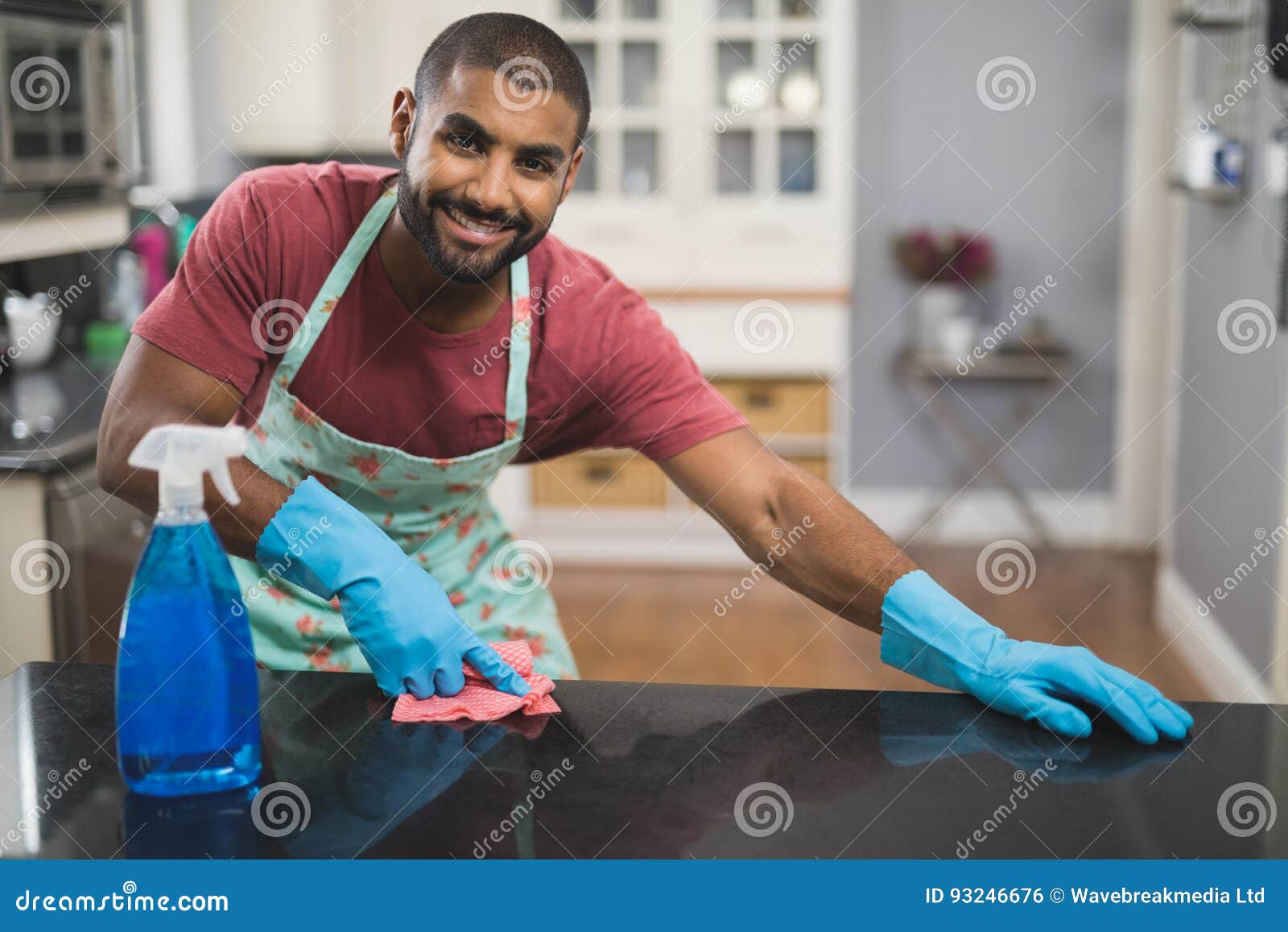 Portrait of Smiling Man Cleaning Counter in Kitchen Stock Photo - Image ...