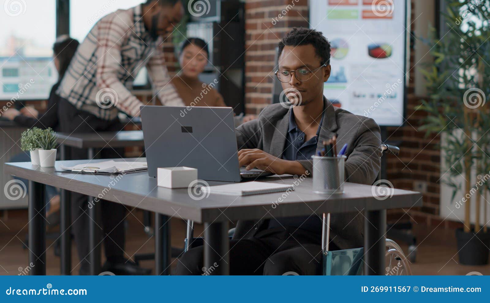 Portrait of Smiling Man with Disability Working on Project Stock Image ...