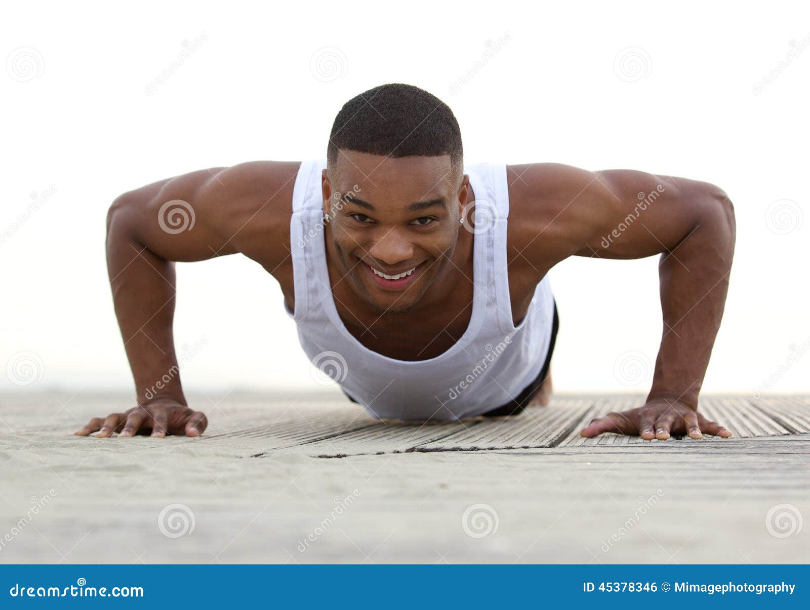 Portrait of a Smiling Man Doing Push Ups Stock Photo - Image of looking ...