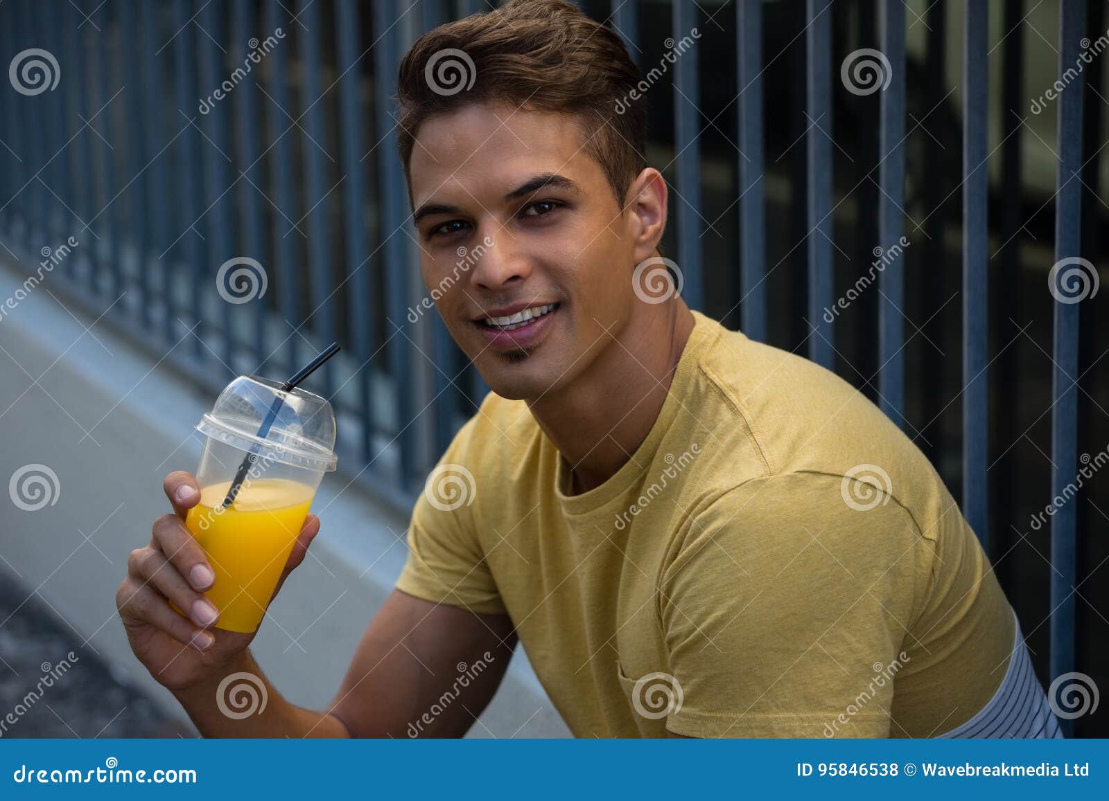 Portrait of Smiling Man Holding Juice Stock Photo - Image of leisure ...