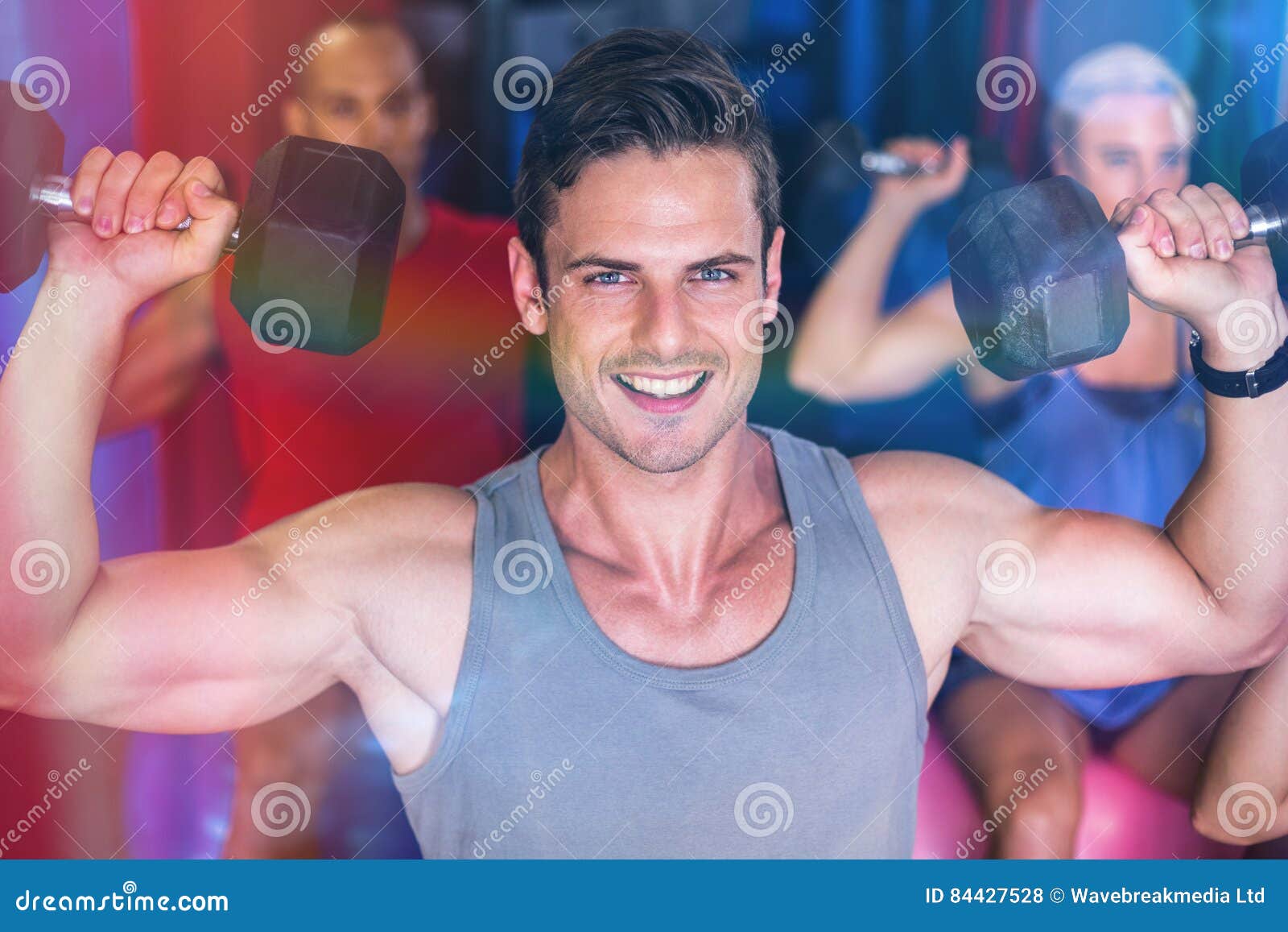 Portrait of Smiling Man Lifting Dumbbell in Gym Stock Photo - Image of ...