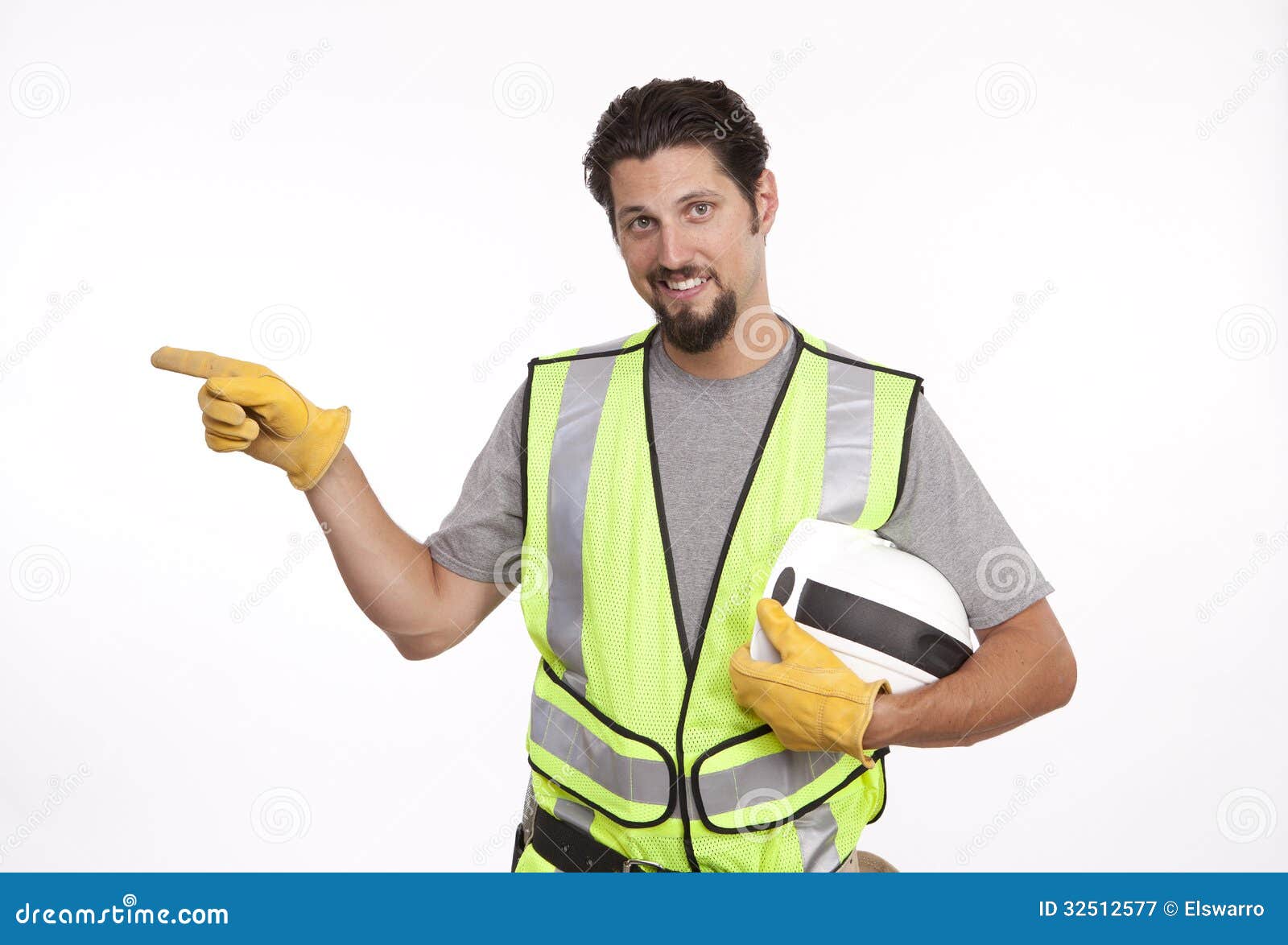 Portrait Of A Smiling Manual Worker Pointing Sideways Royalty-Free ...