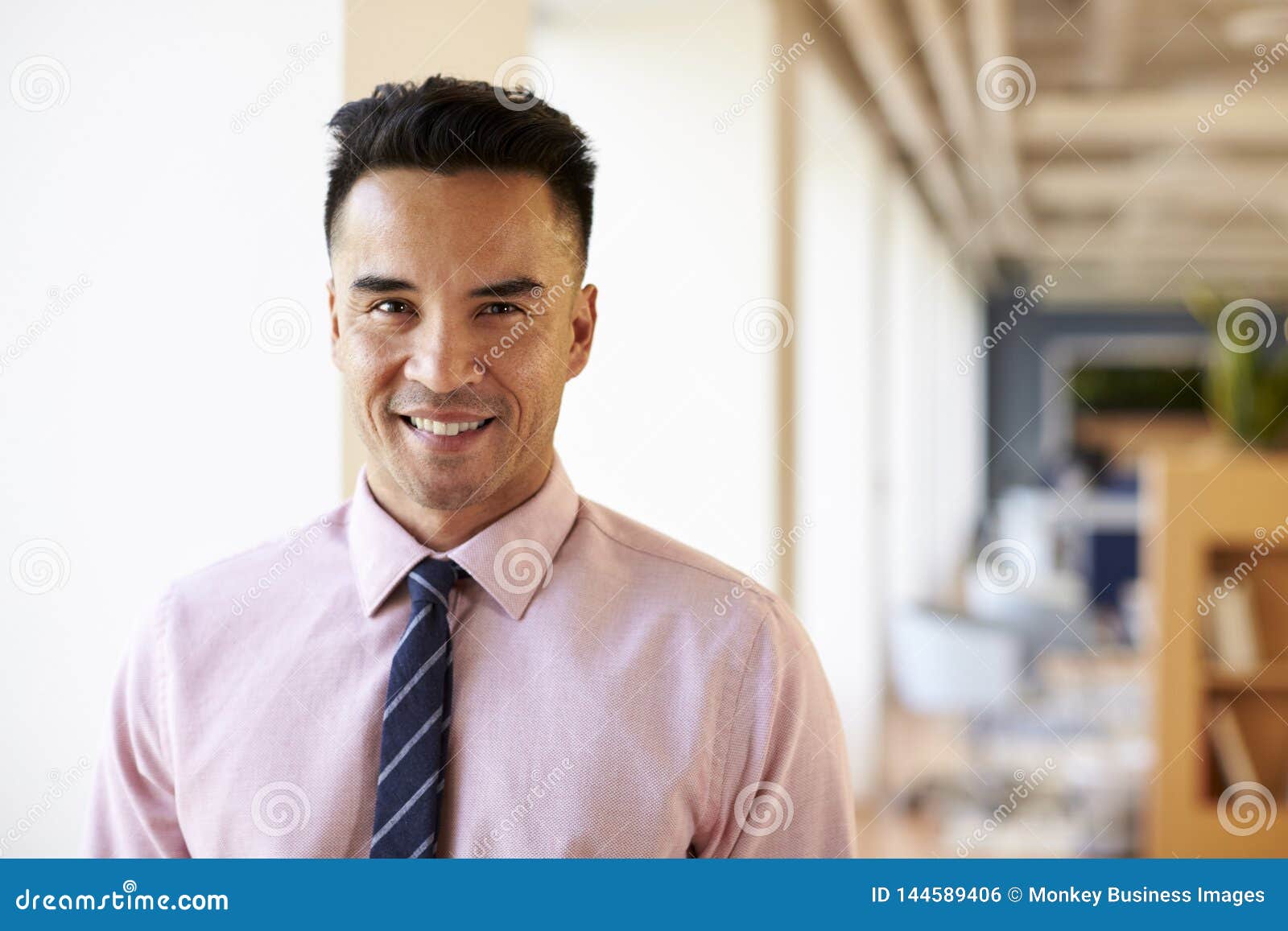 Portrait of Smiling Mature Businessman in Modern Office Standing by ... Portrait of Smiling Mature Businessman in Modern Office Standing by ...