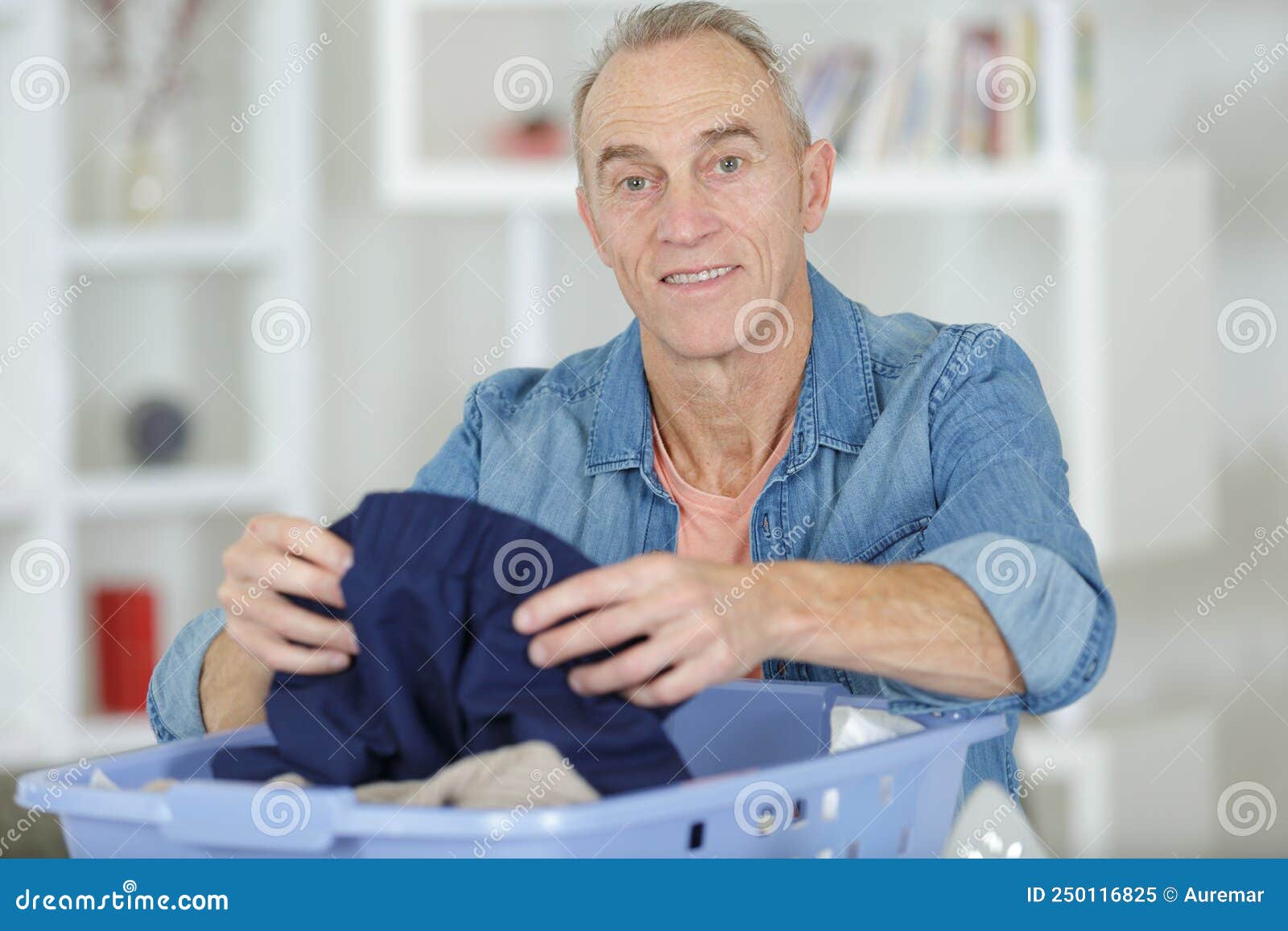 Portrait Smiling Mature Man Holding Laundry Basket Stock Image Image Of Basket Cloth 250116825