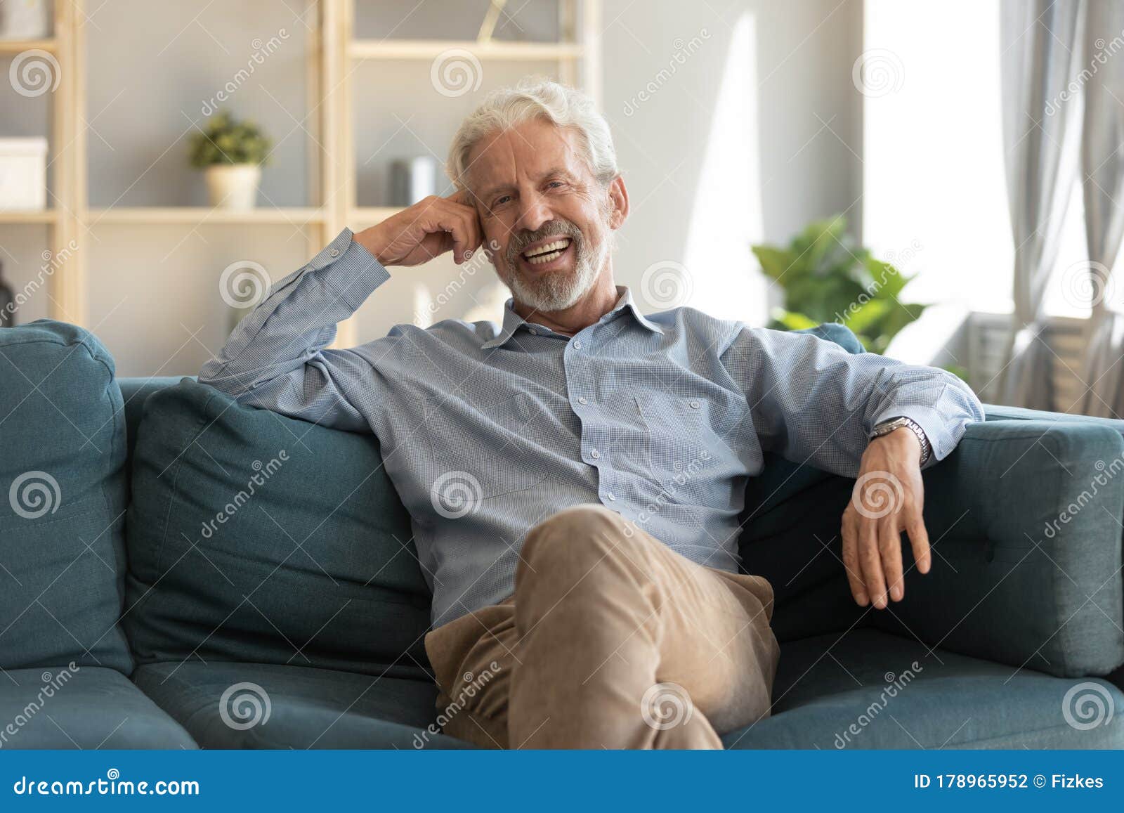 Portrait Smiling Mature Man Sitting on Couch at Home Stock Photo ... Portrait Smiling Mature Man Sitting on Couch at Home Stock Photo ...