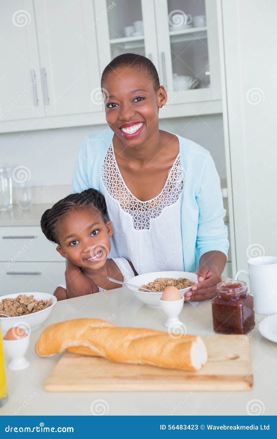 Portrait Smiling Mother And Daughter Eating Together Stock Image