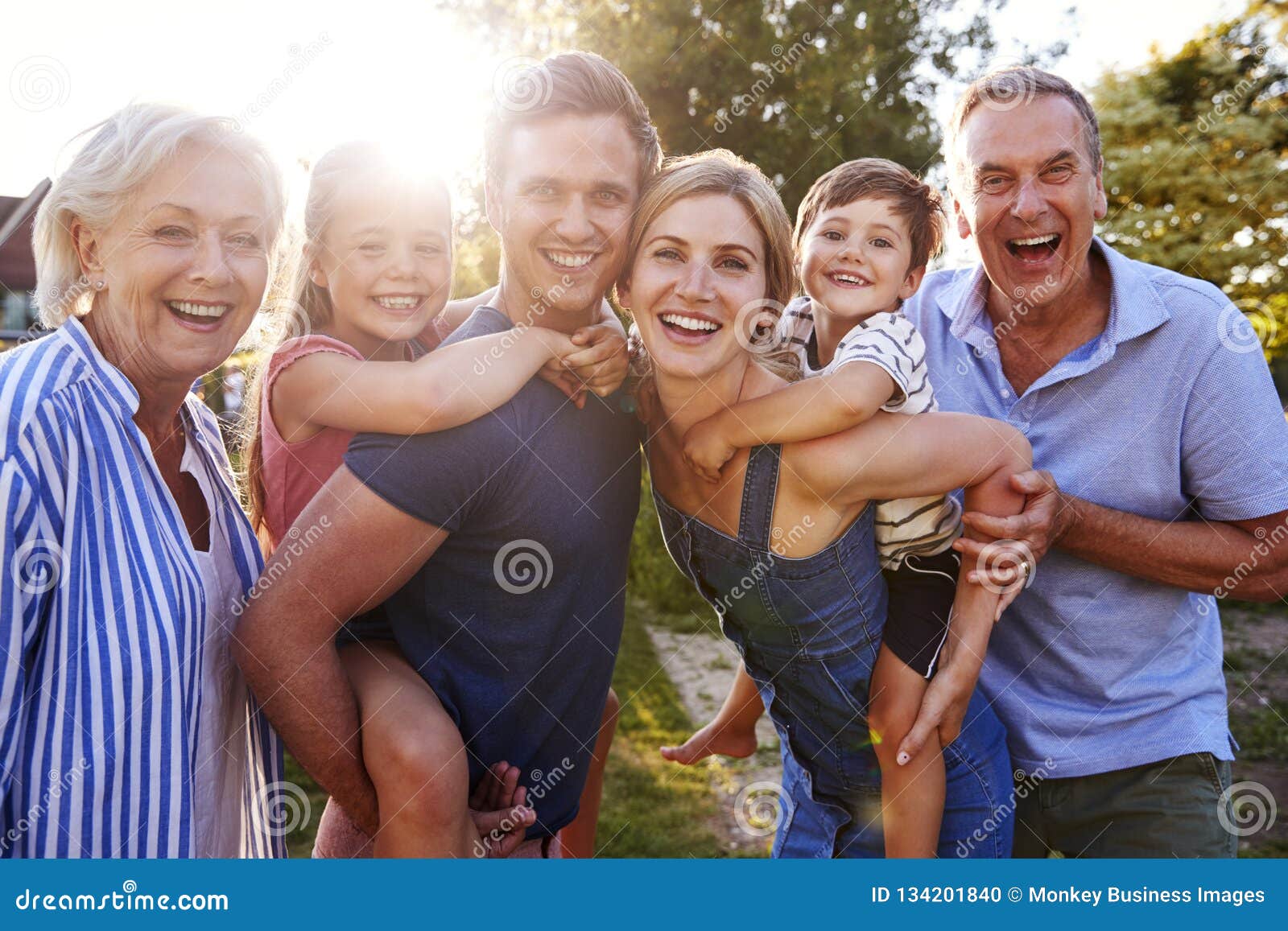 Portrait of Smiling Multi Generation Family Outdoors in Summer Park ... Portrait of Smiling Multi Generation Family Outdoors in Summer Park ...