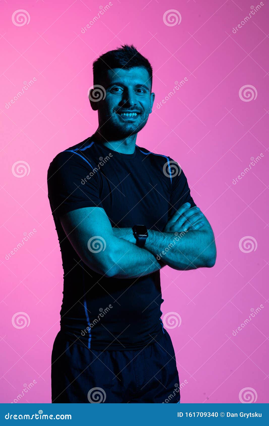 Portrait of a Smiling Muscular Man Standing with Arms Folded Isolated ... Portrait of a Smiling Muscular Man Standing with Arms Folded Isolated ...
