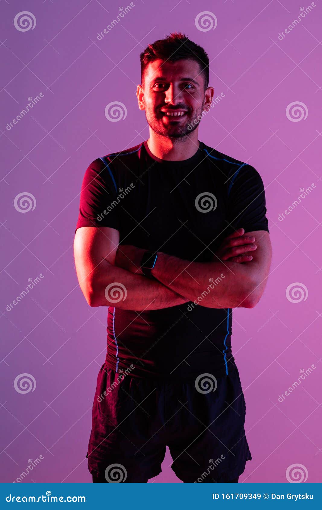 Portrait of a Smiling Muscular Man Standing with Arms Folded Isolated ... Portrait of a Smiling Muscular Man Standing with Arms Folded Isolated ...