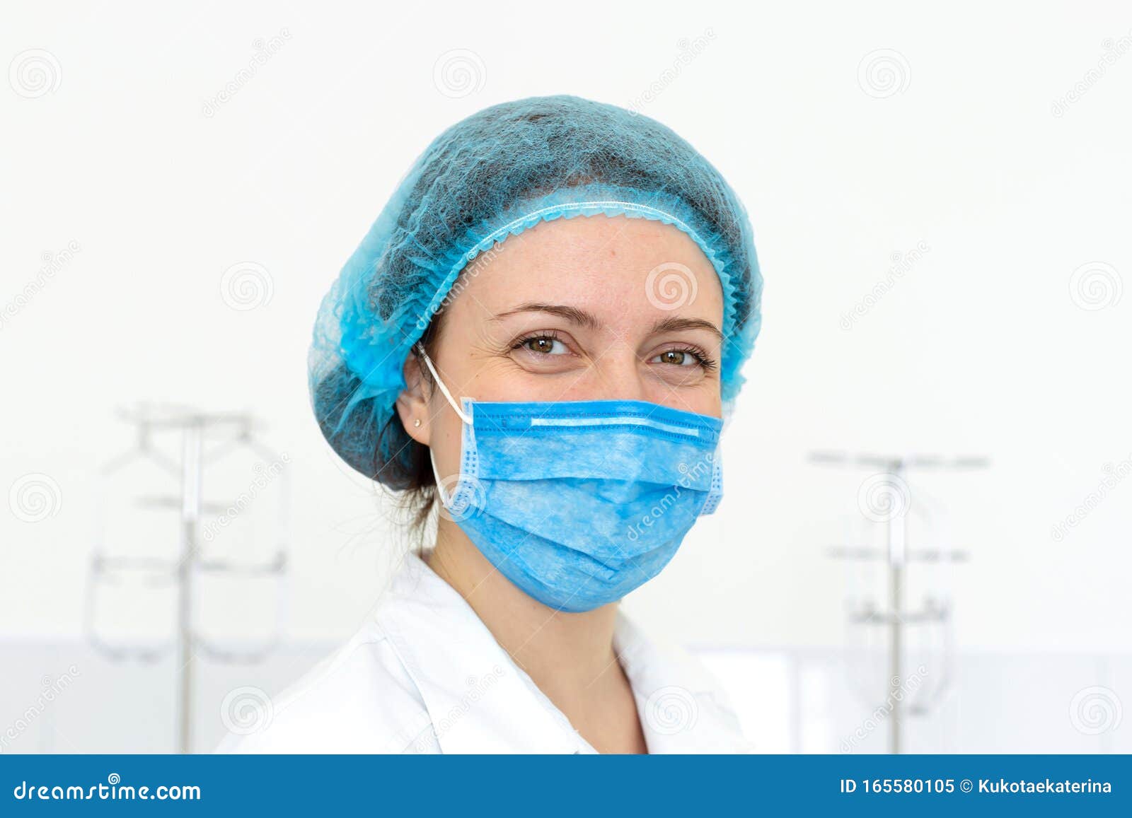 Portrait of a Smiling Nurse in a Protective Cap and Mask Stock Image ...