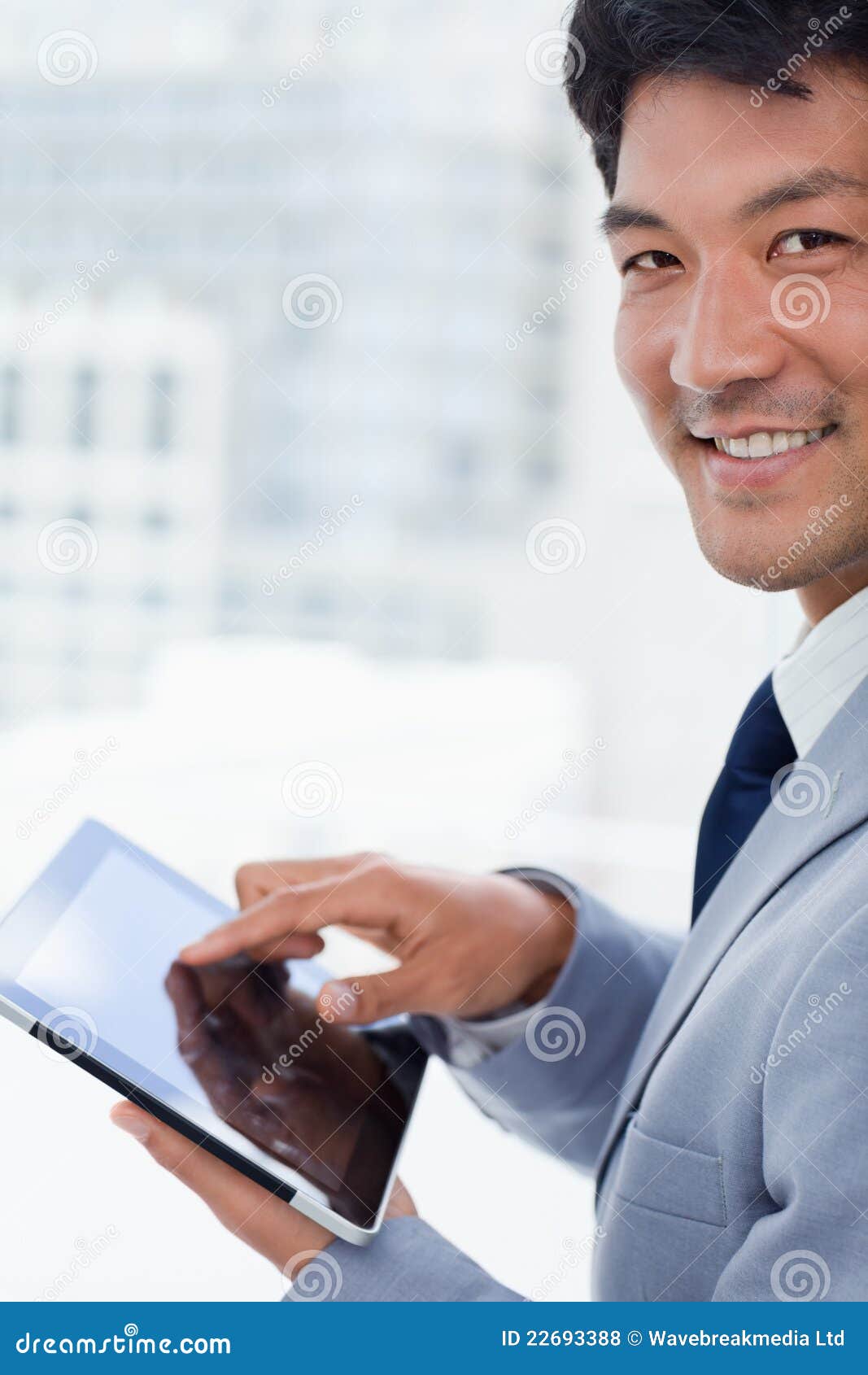 Portrait of a Smiling Office Worker Using a Tablet Computer Stock Photo ...