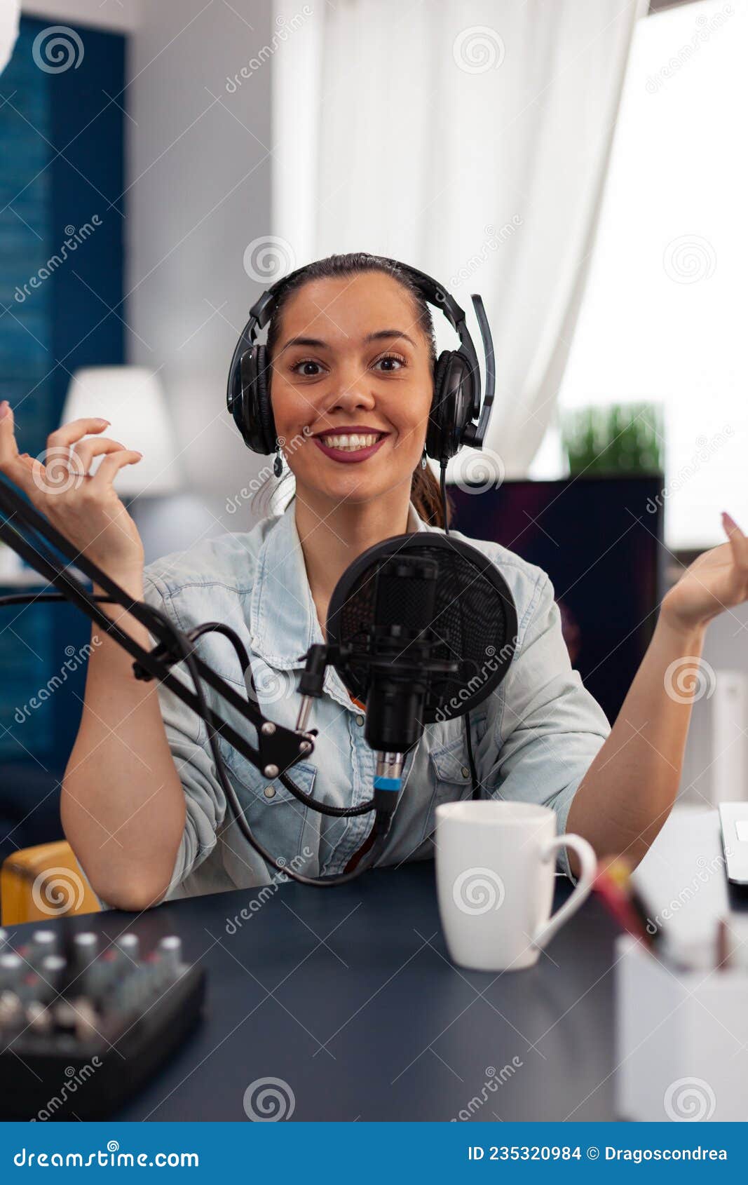 Portrait of Smiling Presenter Streaming Podcast Using Microphone. Stock ...