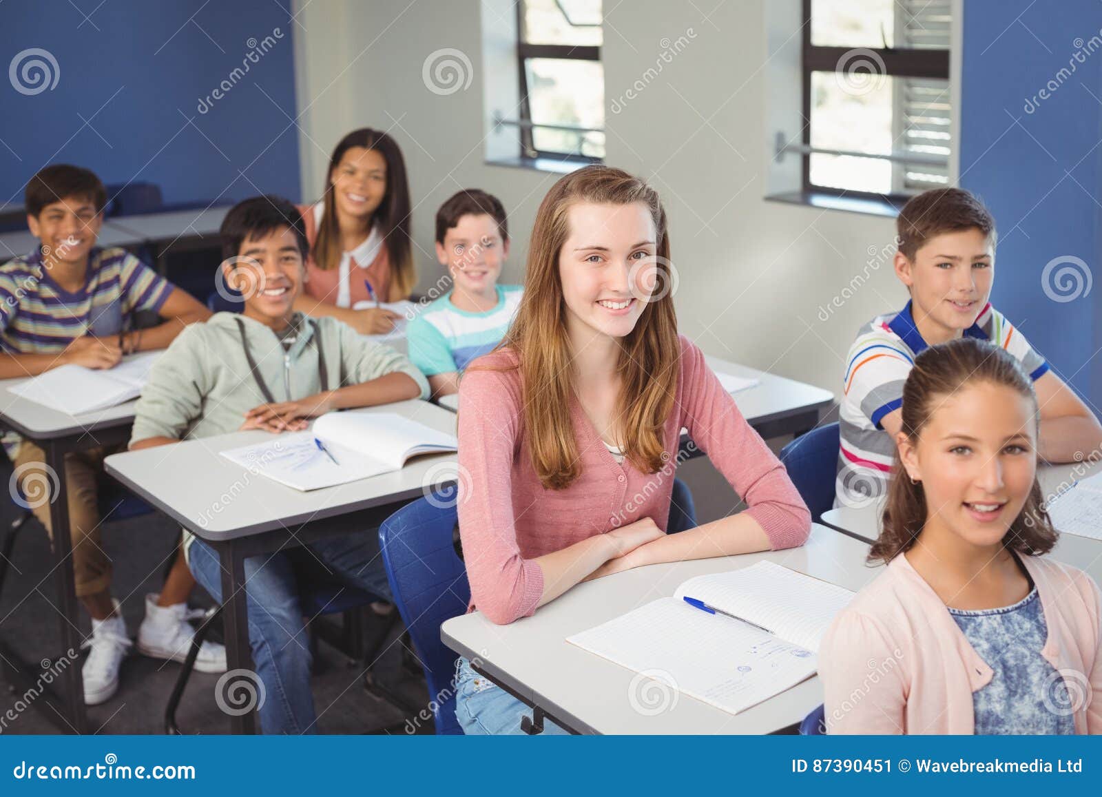 Portrait of Smiling School Kids Sitting in Classroom Stock Image ...
