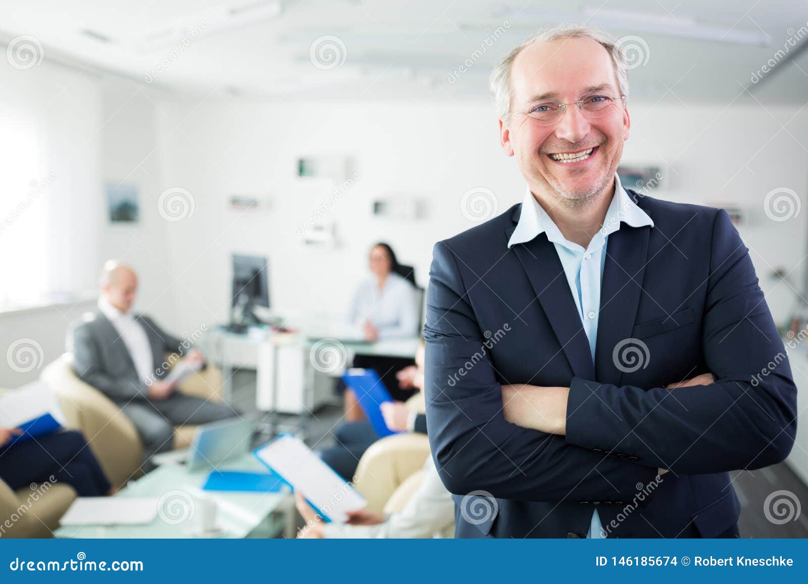 Smiling Senior Businessman Standing Arms Crossed in Office Stock Photo ... Smiling Senior Businessman Standing Arms Crossed in Office Stock Photo ...