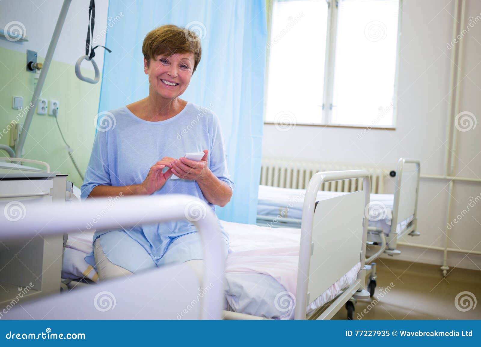 Portrait of Smiling Senior Patient Using Mobile Phone Stock Image ...