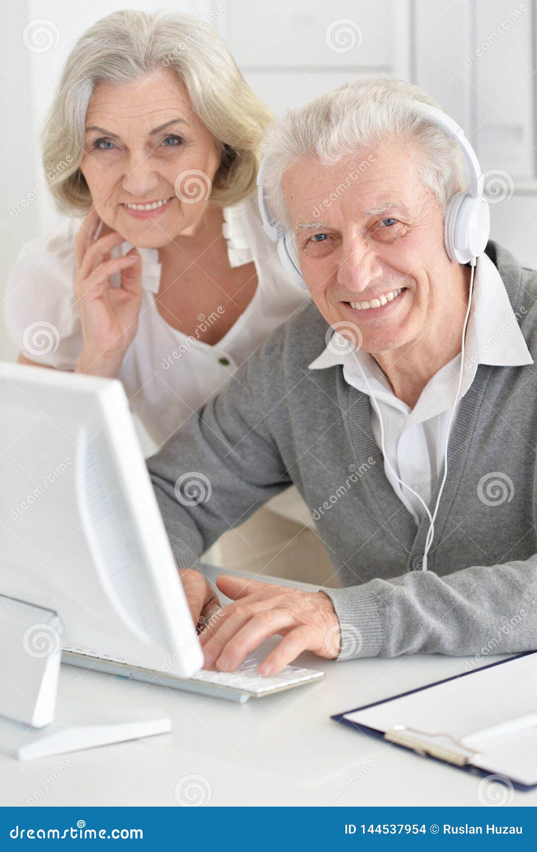 Portrait of Smiling Senior People Working with Computer at Home Stock ...
