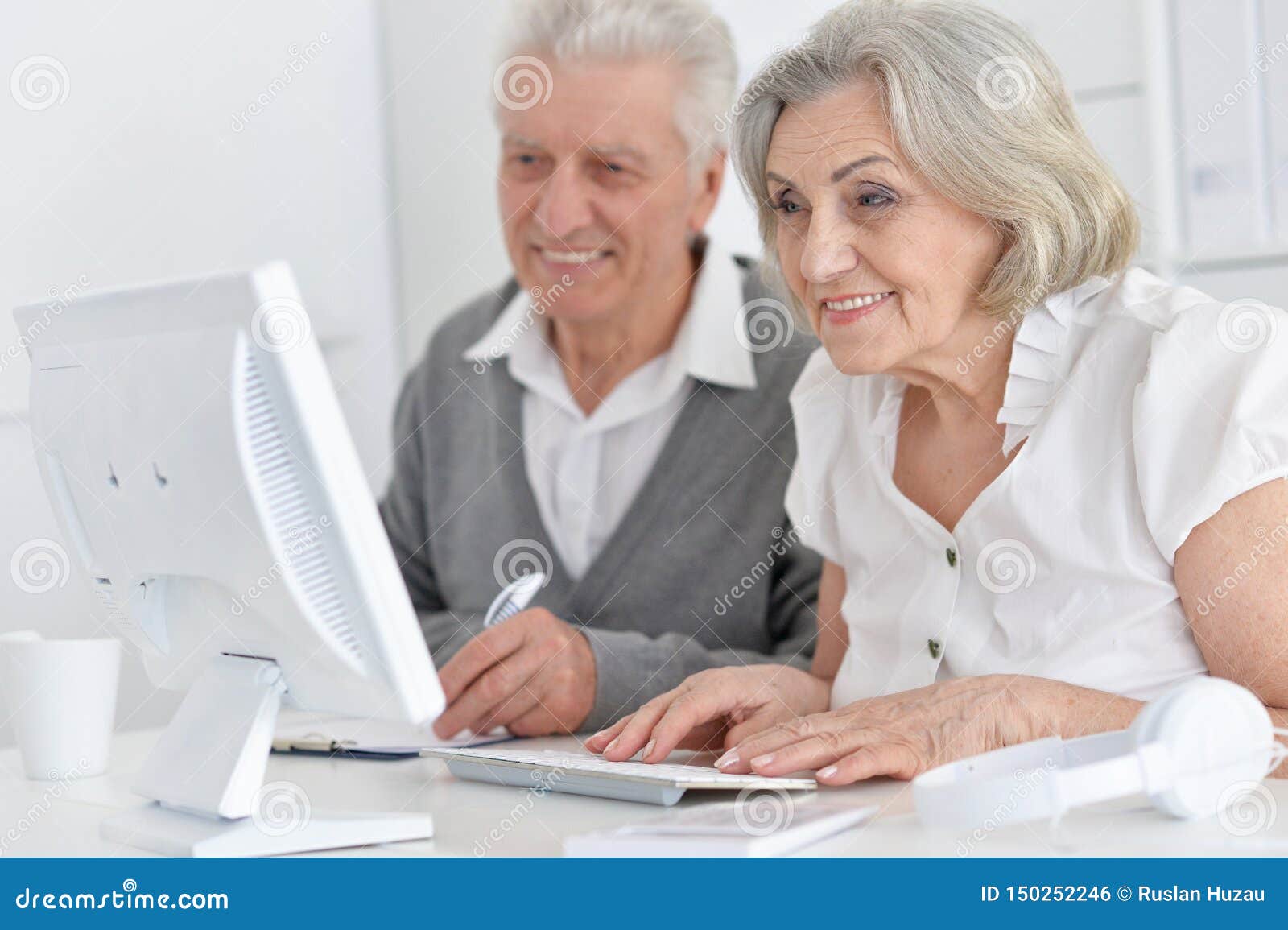 Portrait of Smiling Senior People Working with Computer at Home Stock ...