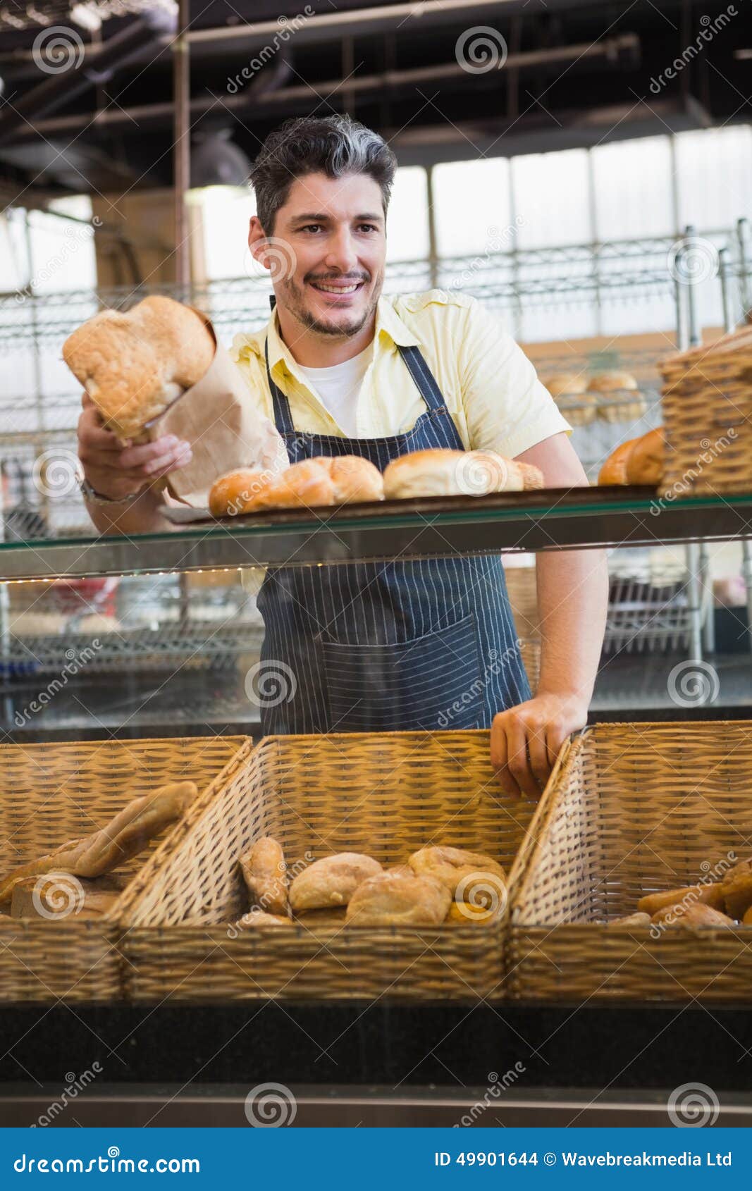 Portrait of Smiling Server Offering Bread Stock Photo - Image of ...