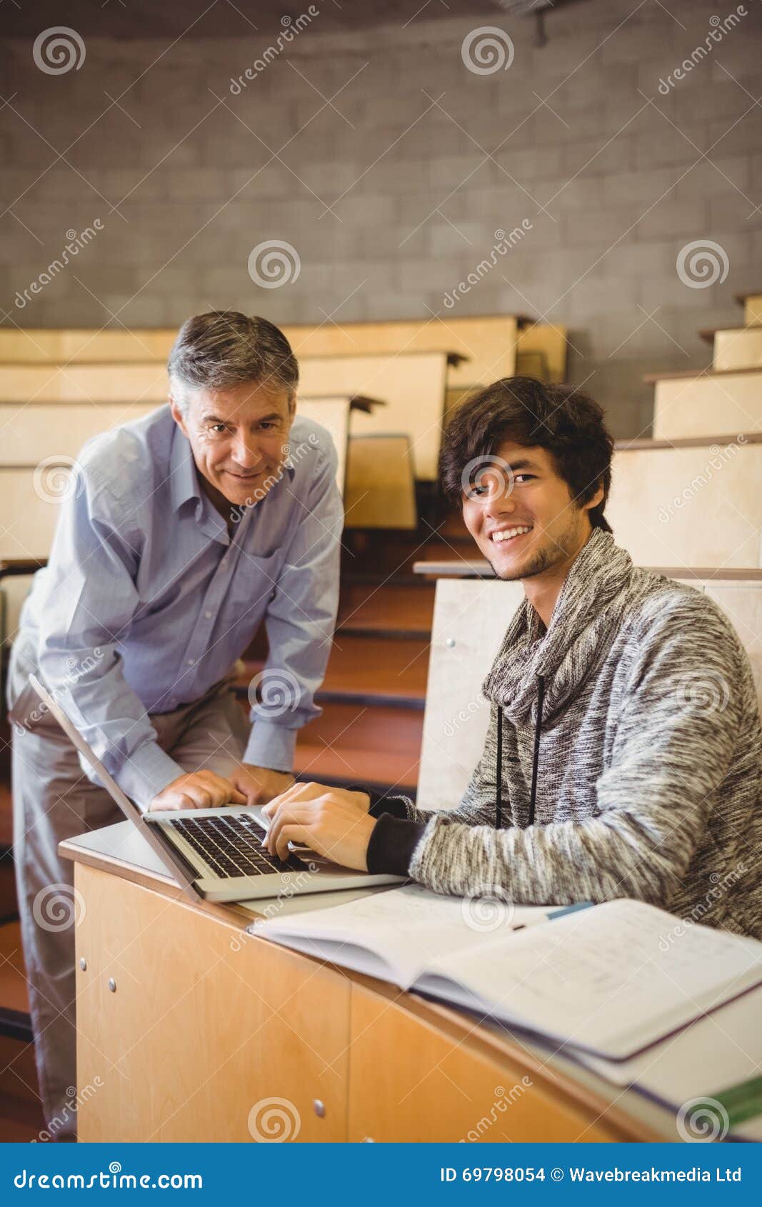 Portrait of Smiling Student with Professor Stock Photo - Image of desk ...