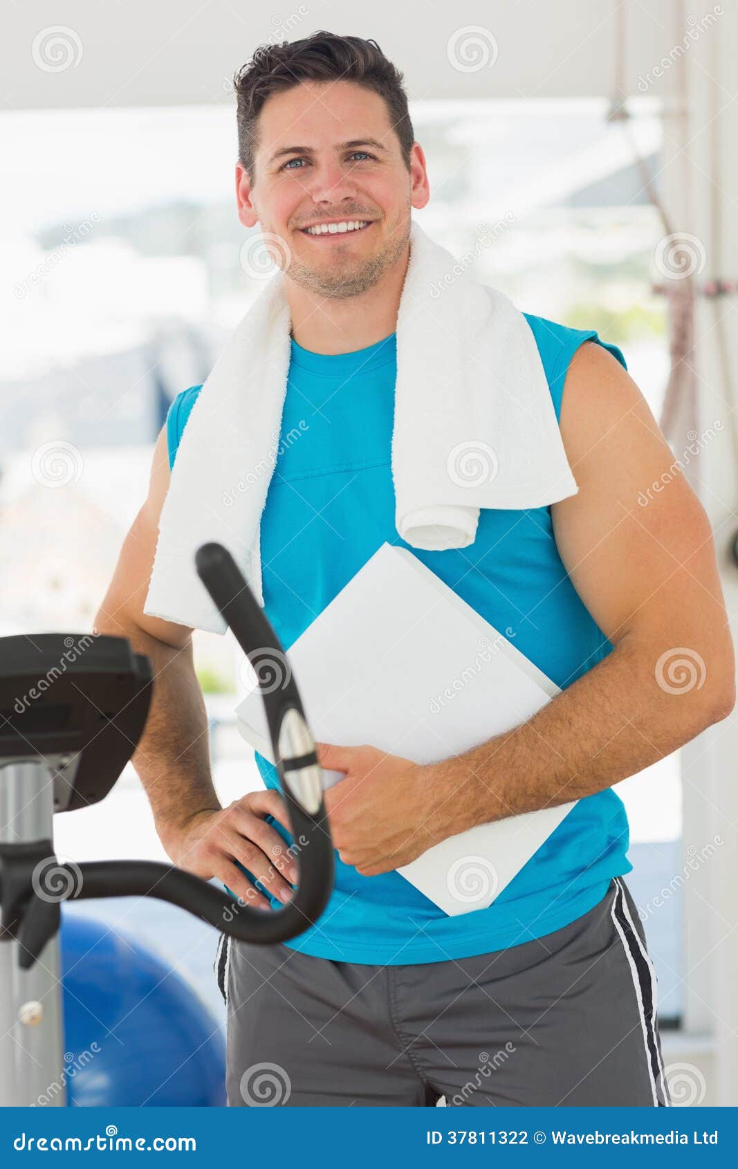 Portrait of a Smiling Trainer with Clipboard in Gym Stock Photo - Image ...