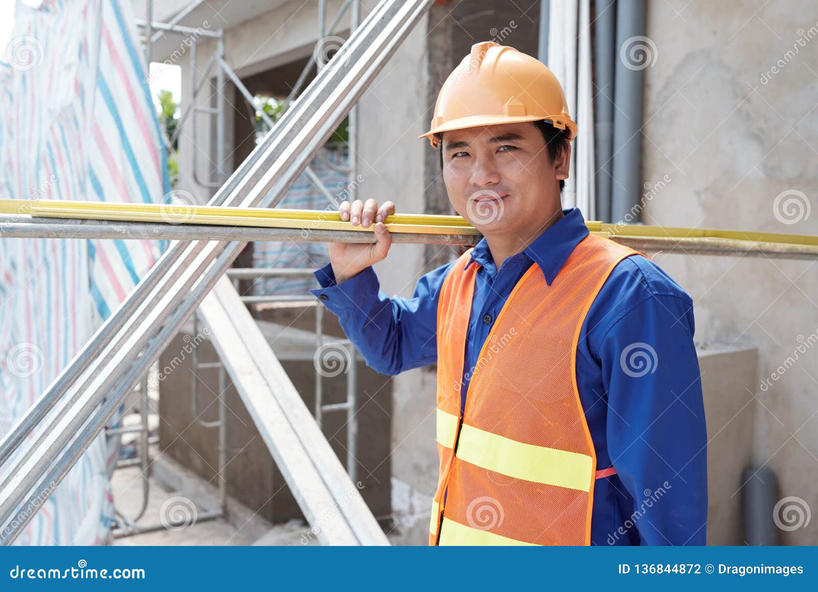 Worker Carrying Construction Materials Stock Photo - Image of building ...